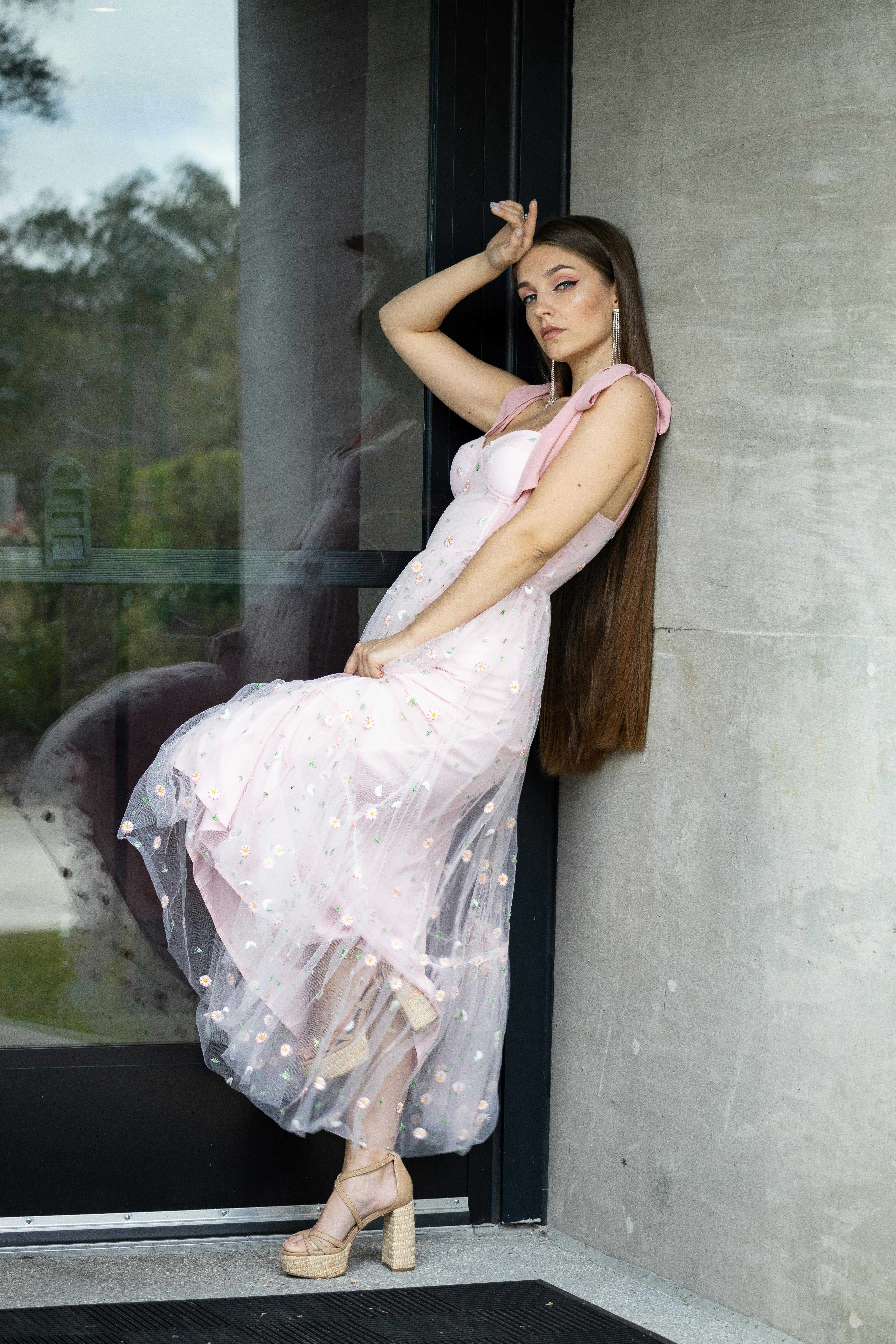Woman in Delicate Pink Dress Posing in Corner of Building · Free Stock ...