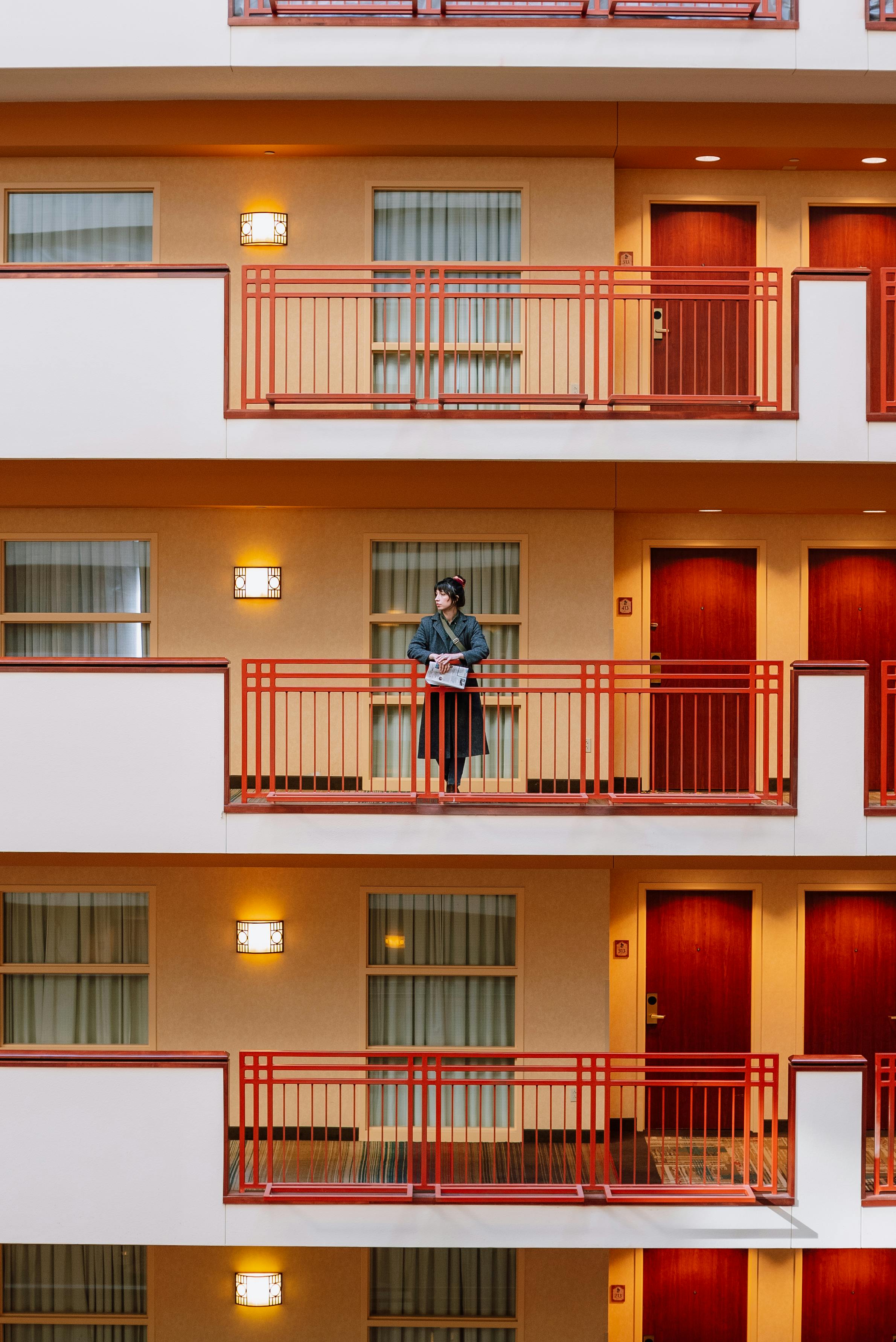 Woman Standing on Balcony · Free Stock Photo