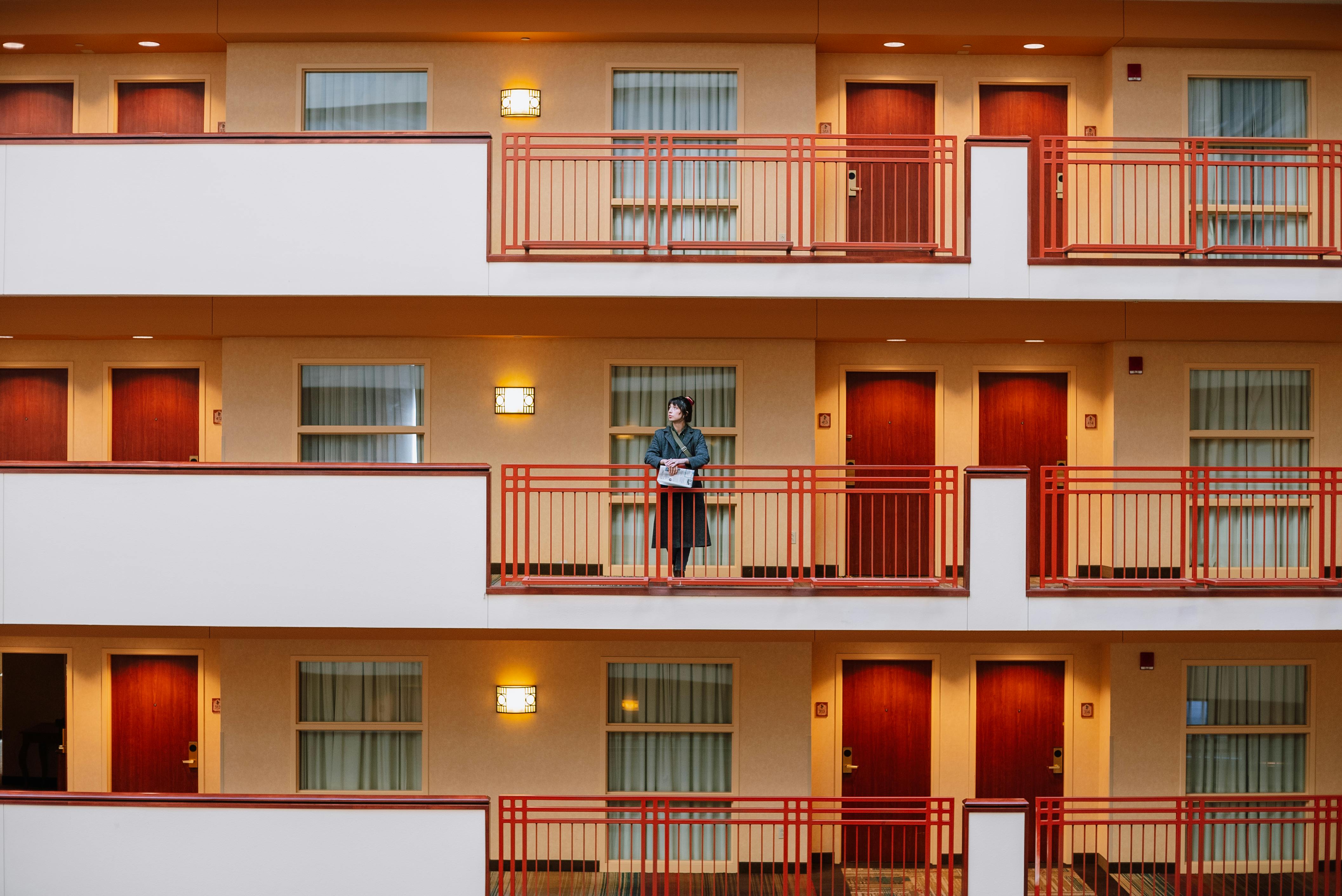 Woman Standing on Balcony · Free Stock Photo