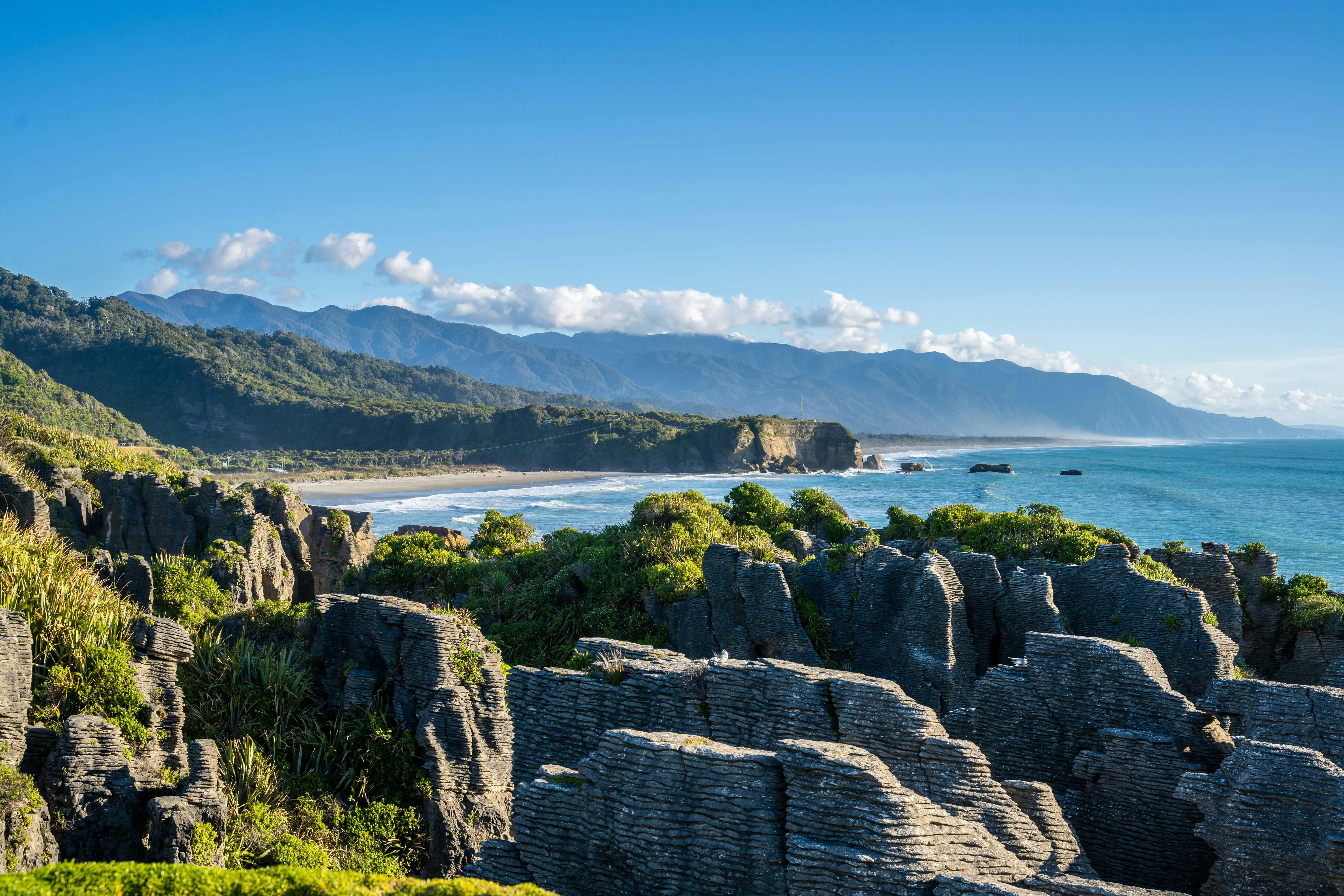 Rocks on Seashore in Mountains Landscape · Free Stock Photo