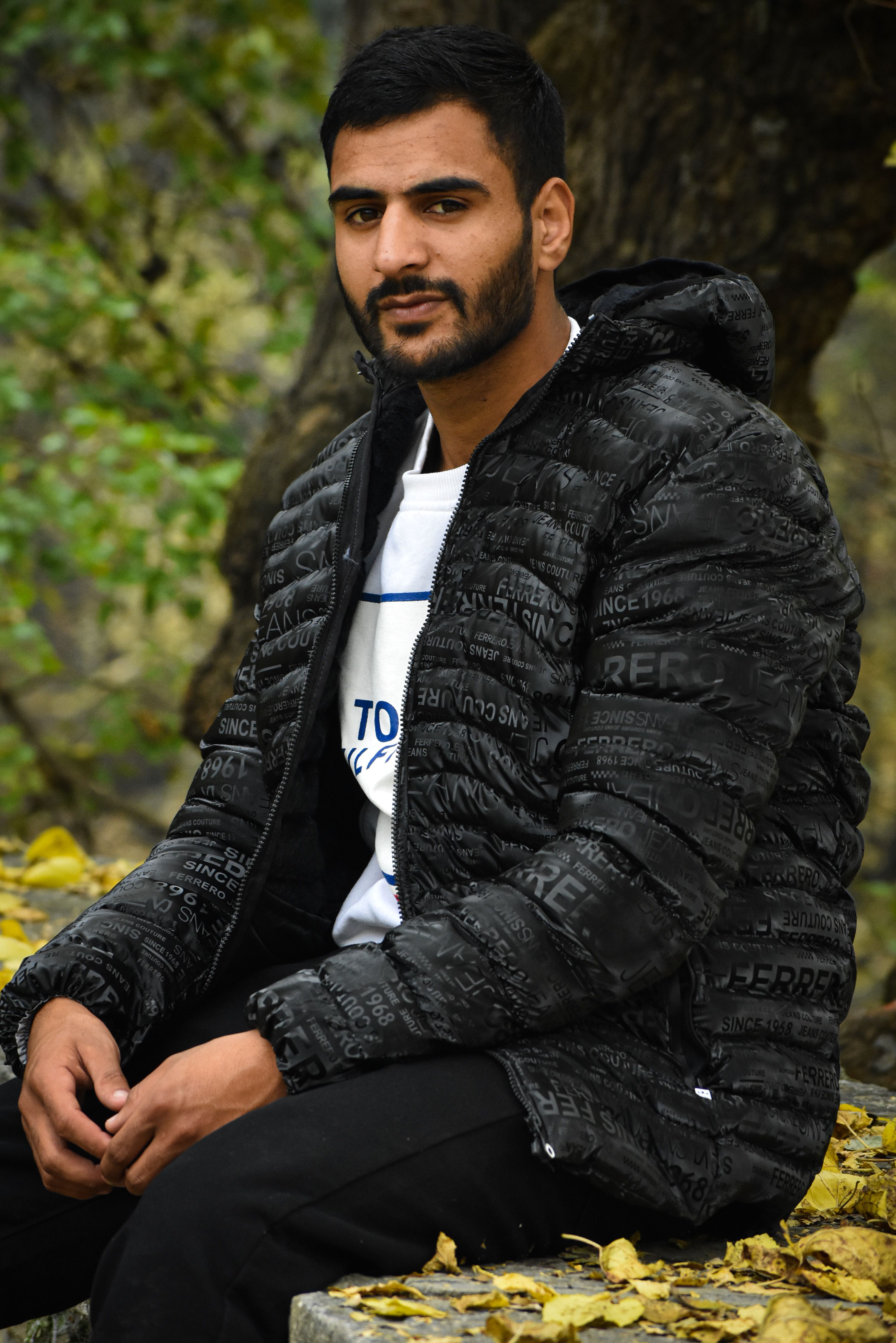 Man Sitting and Posing in Jacket · Free Stock Photo