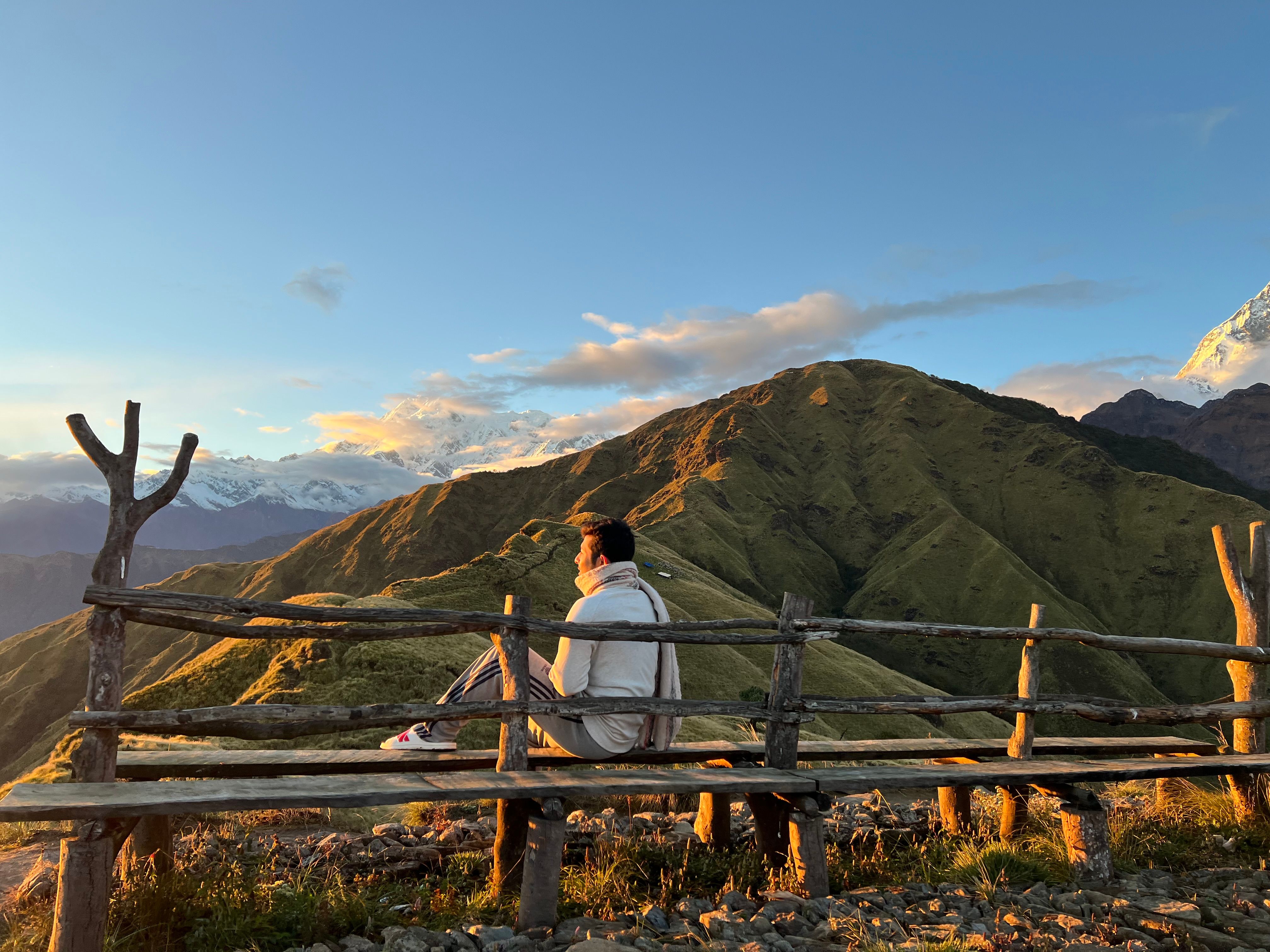 Man Sitting with Hill behind · Free Stock Photo