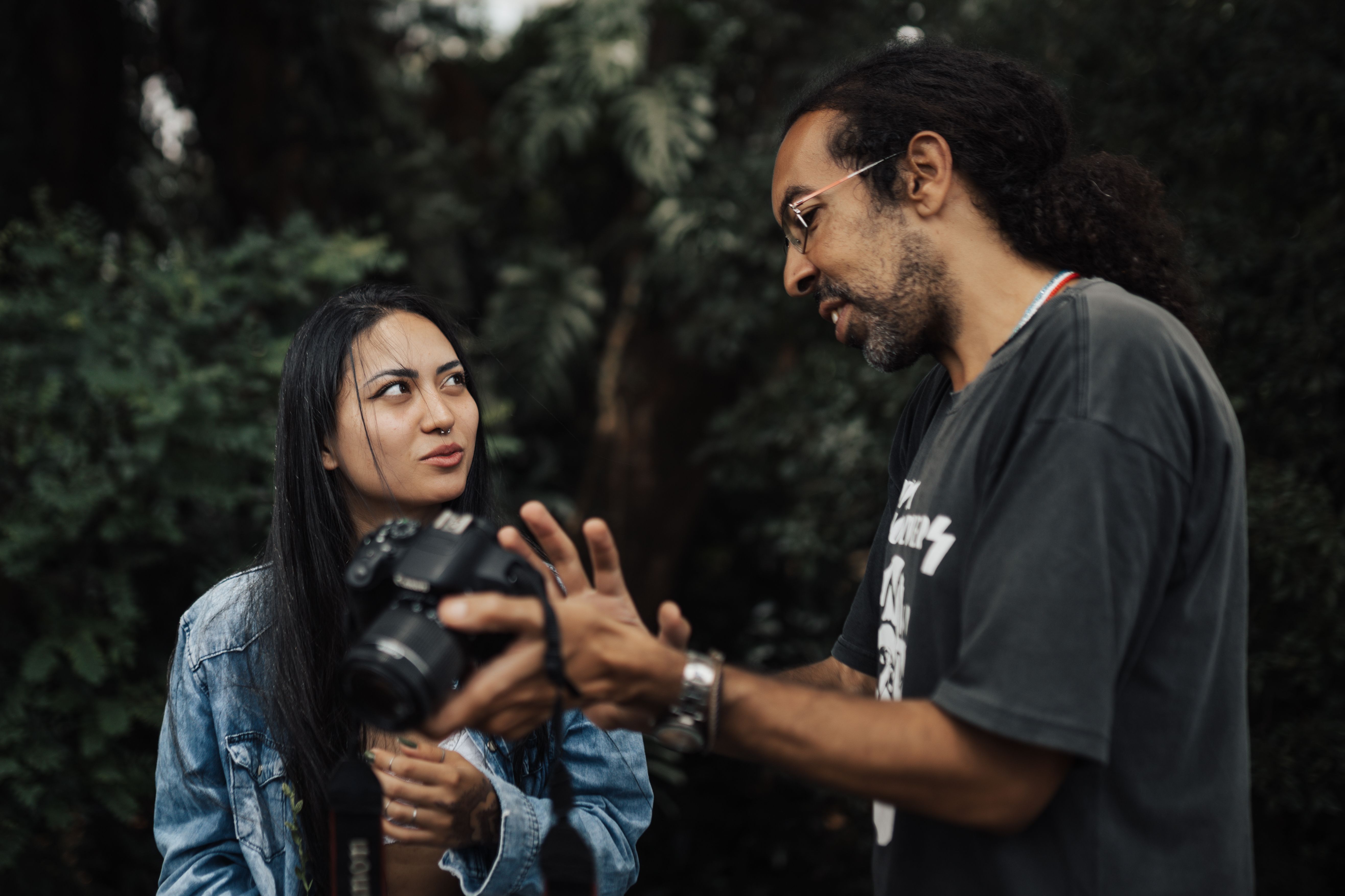 Photo of a Man Showing his Camera to a Woman · Free Stock Photo