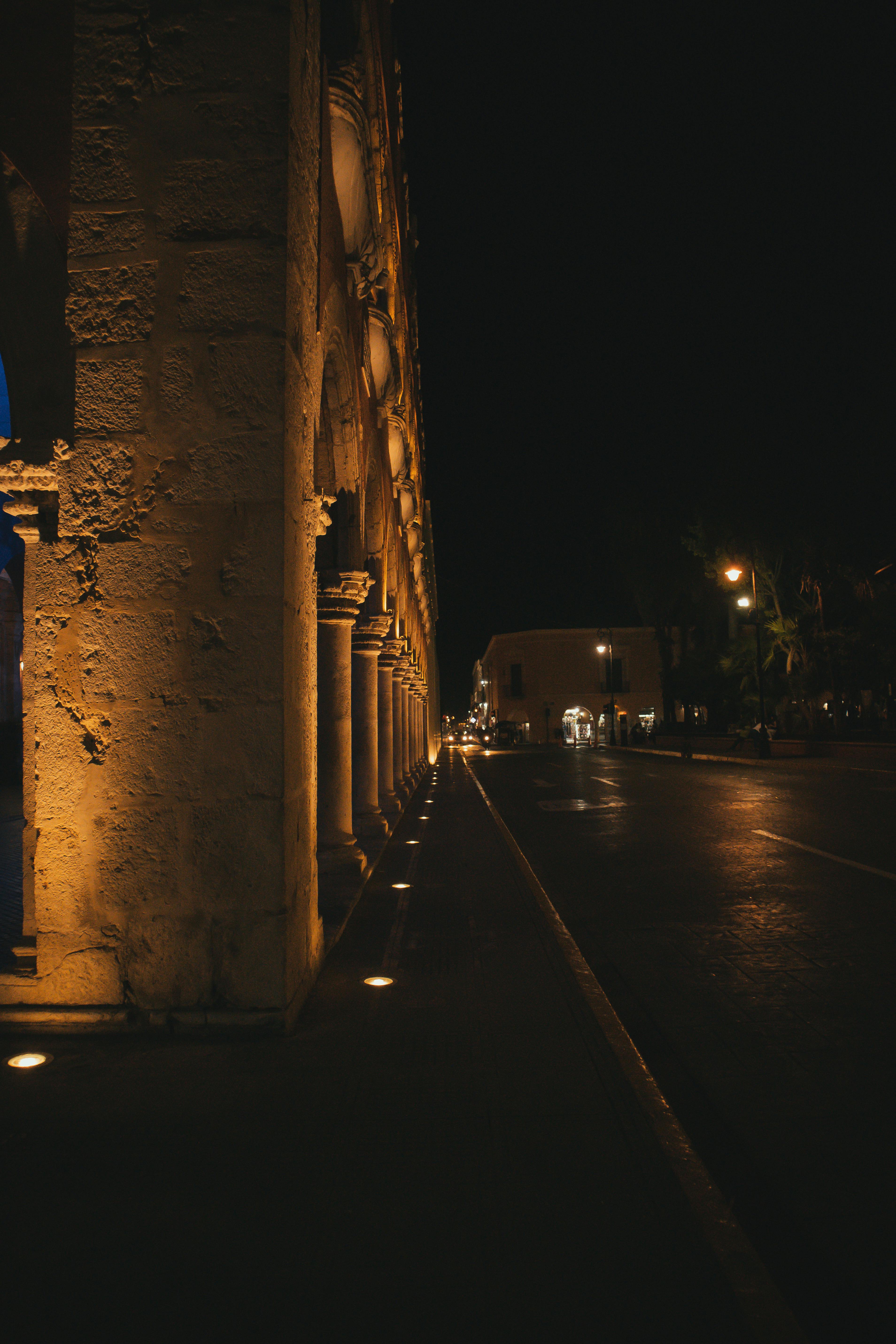 Ligths on Sidewalk near Street at Night · Free Stock Photo