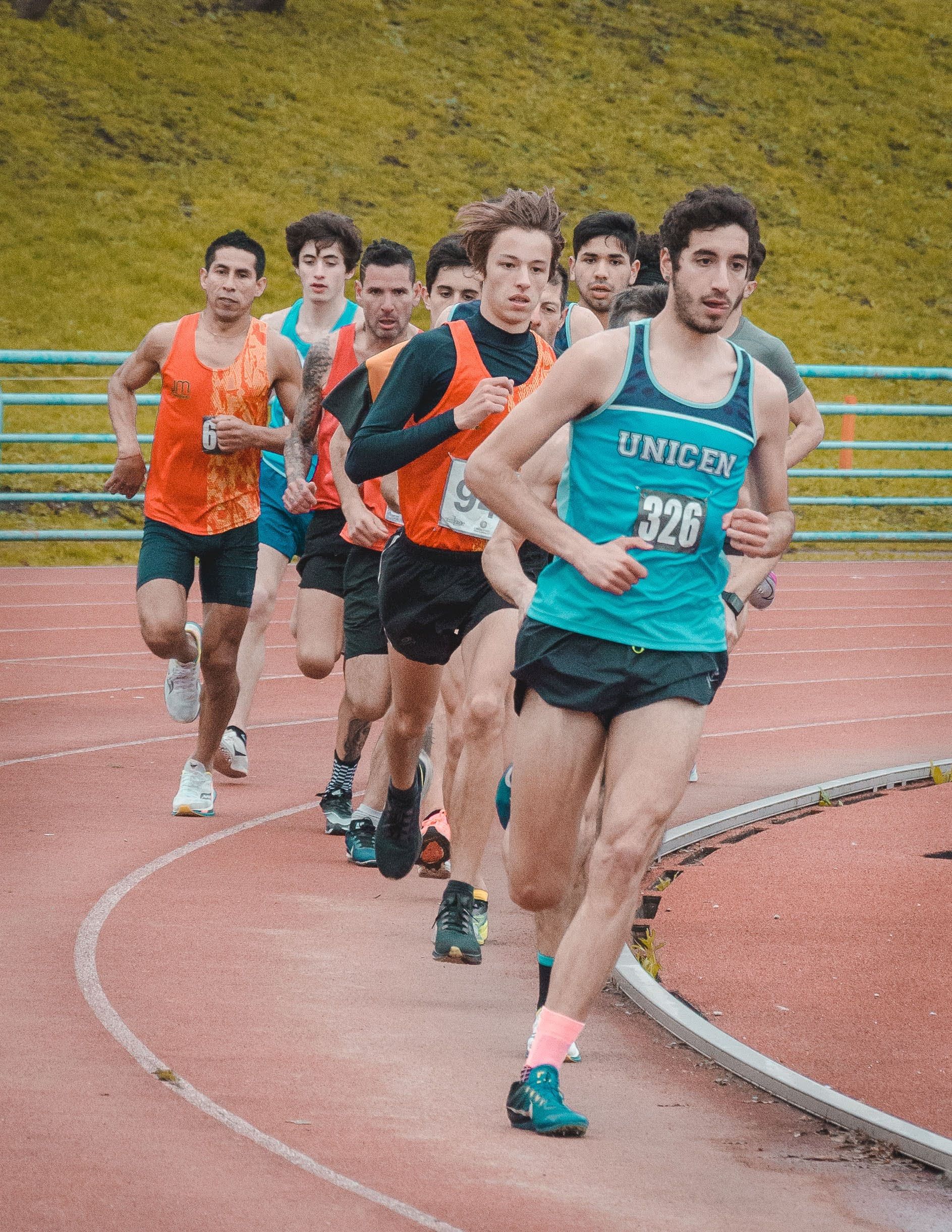 Group of Men Running on a Track · Free Stock Photo