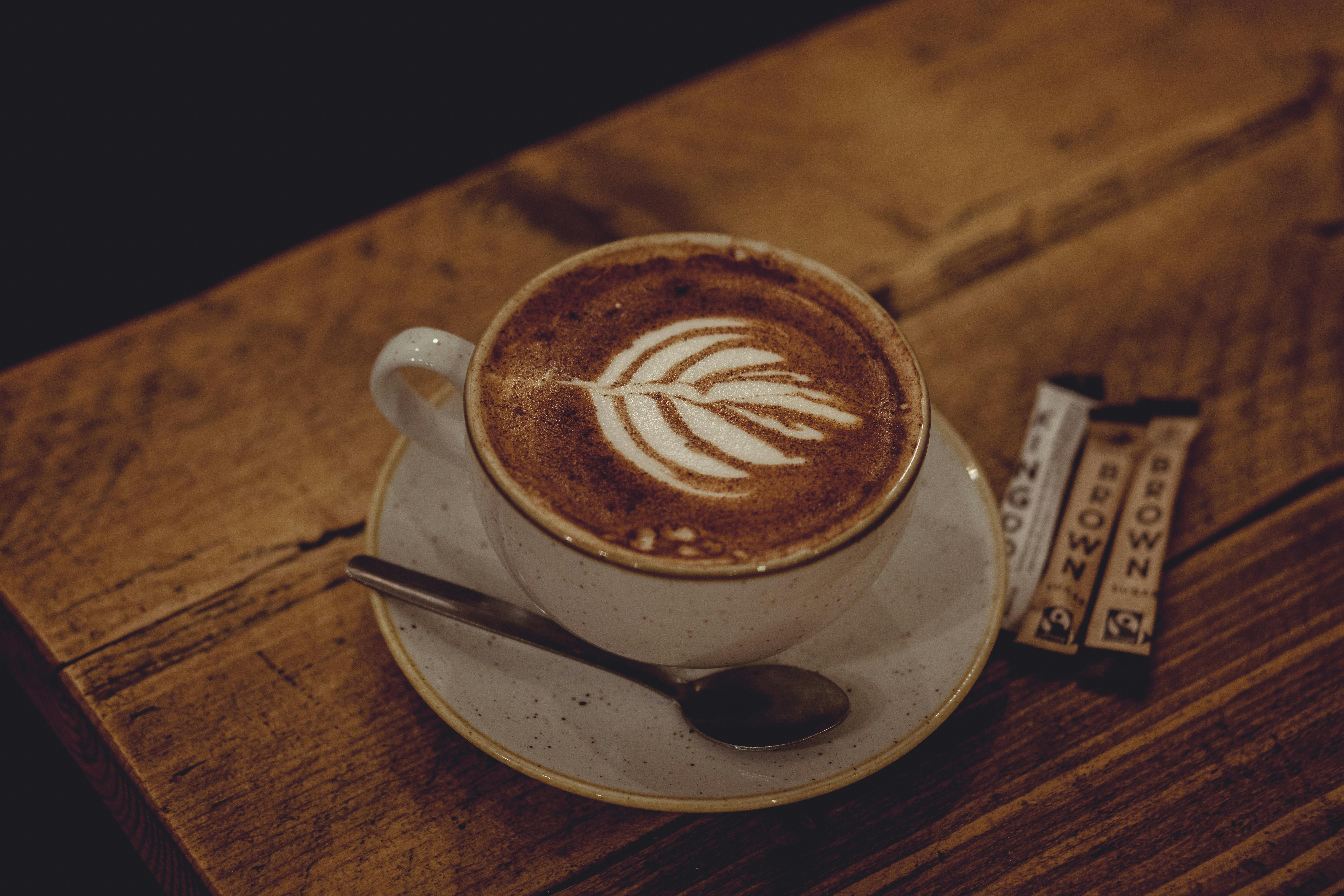 Cup of delicious coffee with froth on breakfast in cafeteria · Free ...