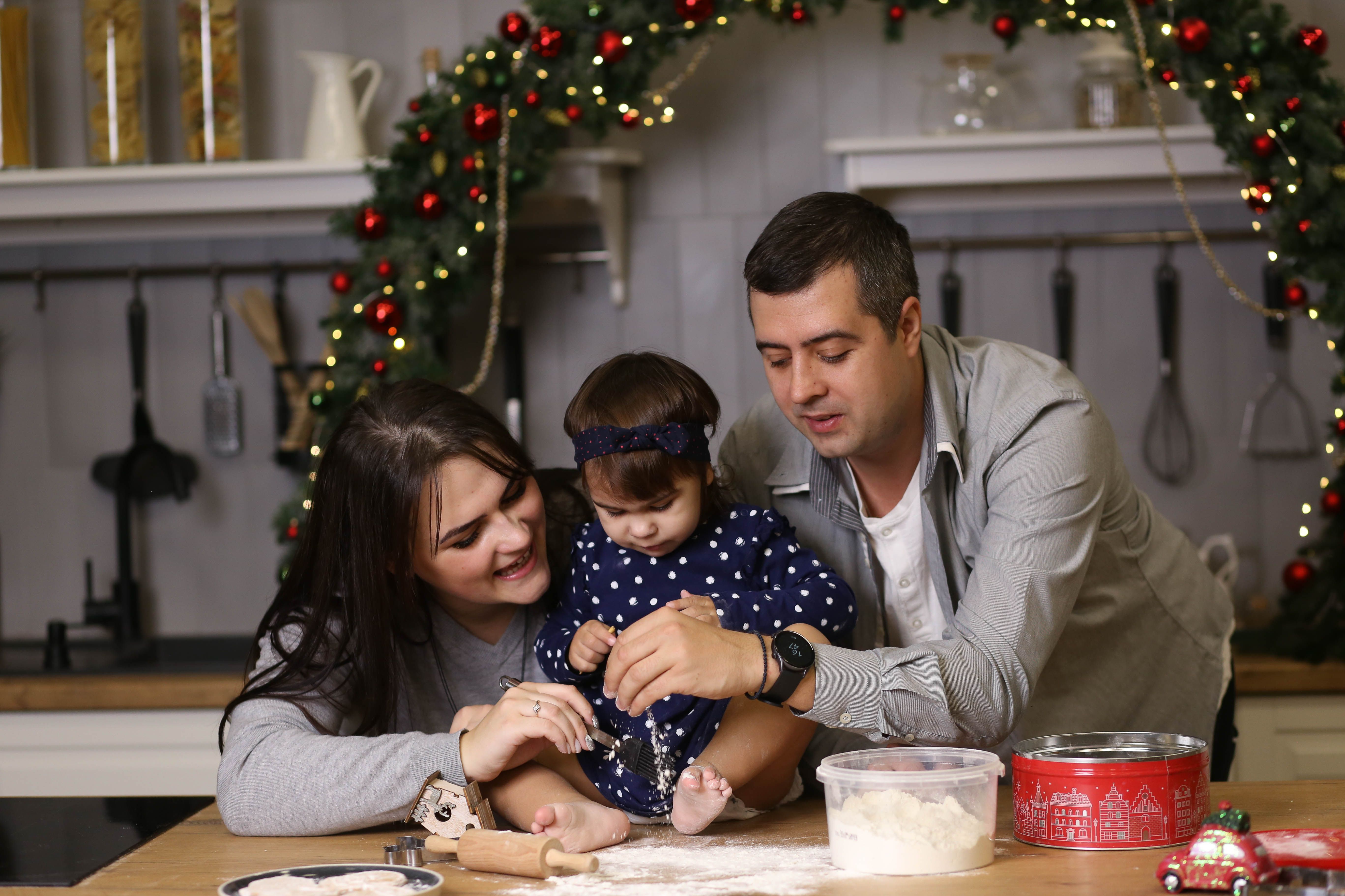 Mother and Father Cooking with Daughter · Free Stock Photo