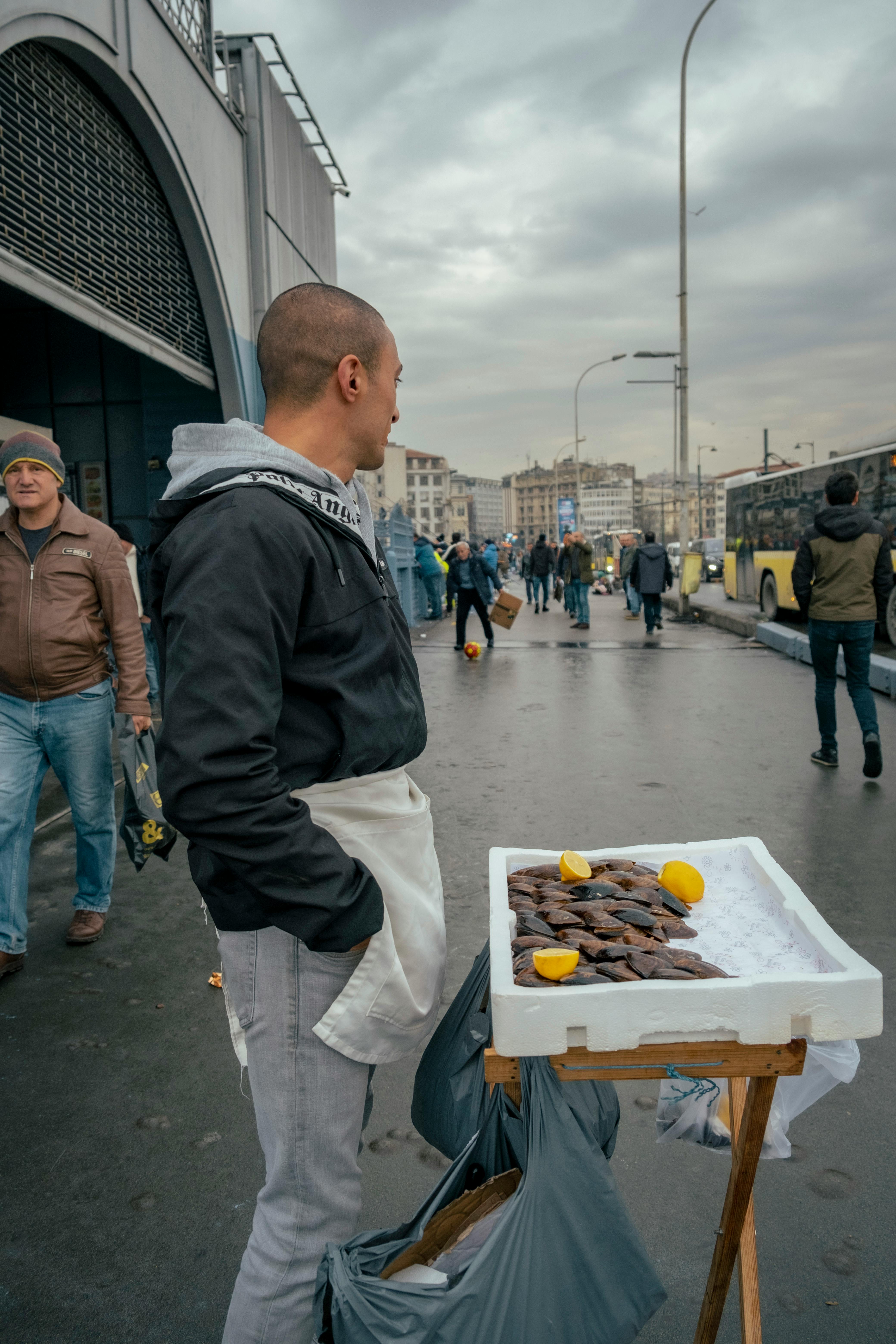 Street Vendor Selling Mussels · Free Stock Photo