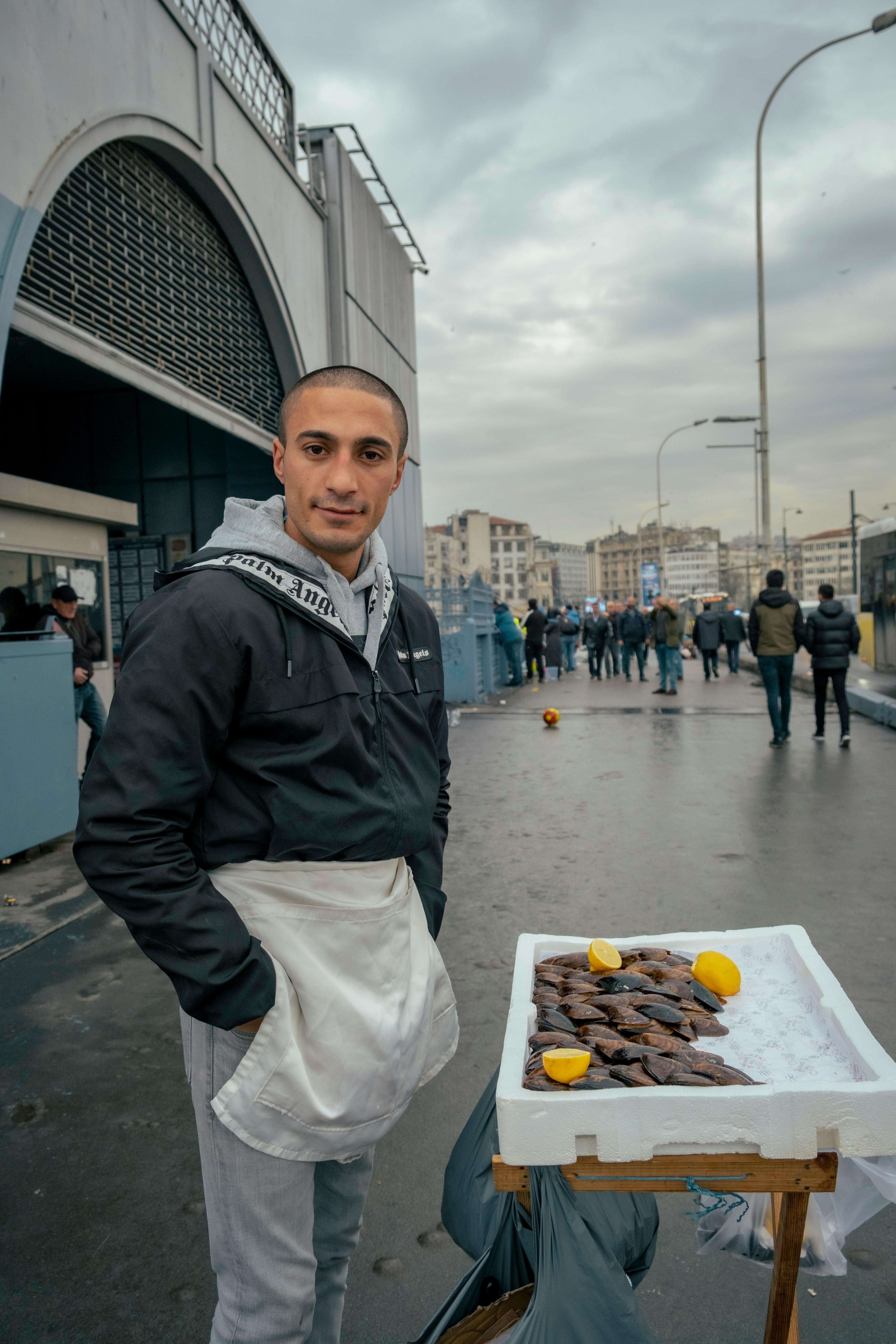 A Vendor Selling Fresh Mussels on the Street while Smiling at the ...
