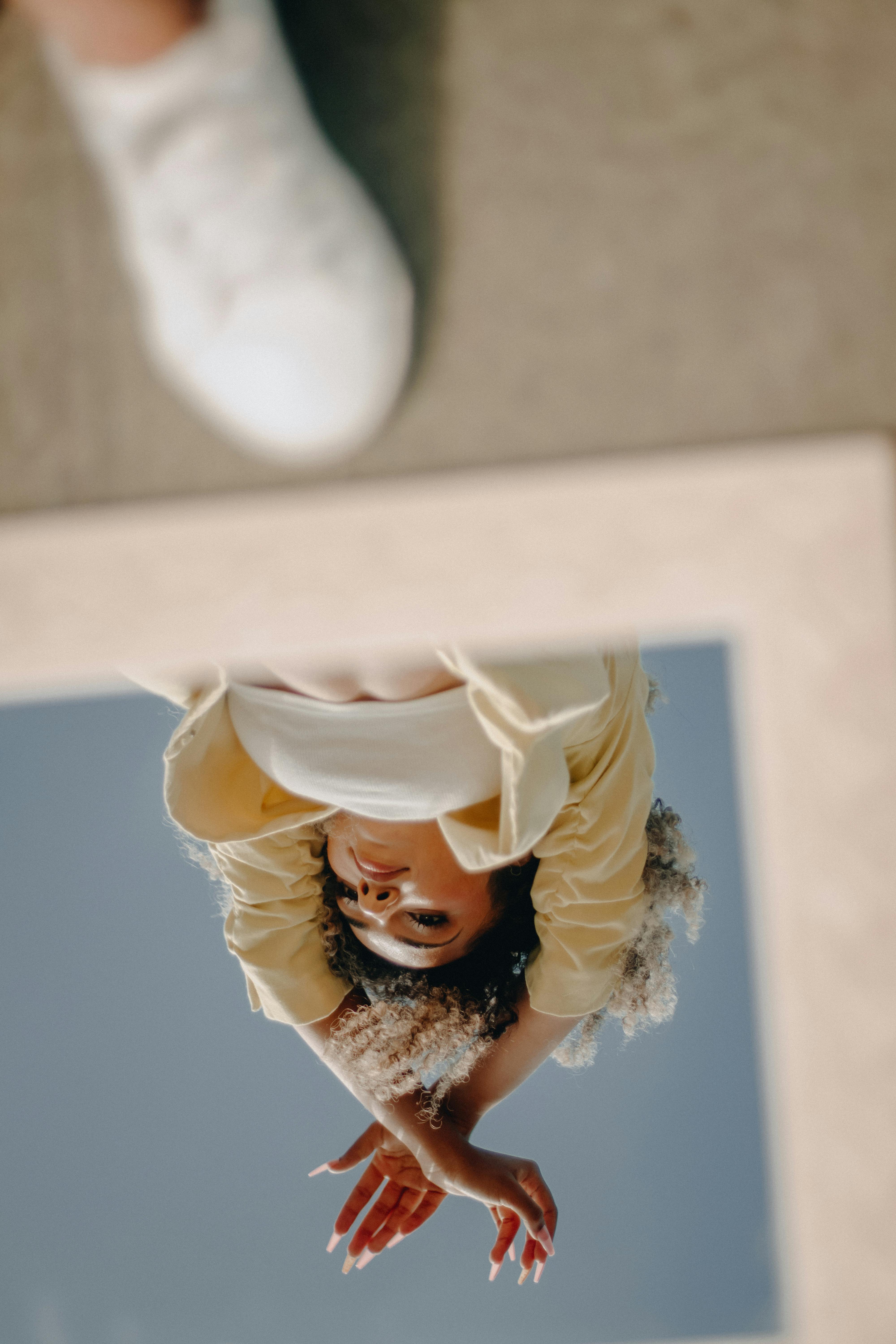 Reflection of a Woman in a Mirror · Free Stock Photo