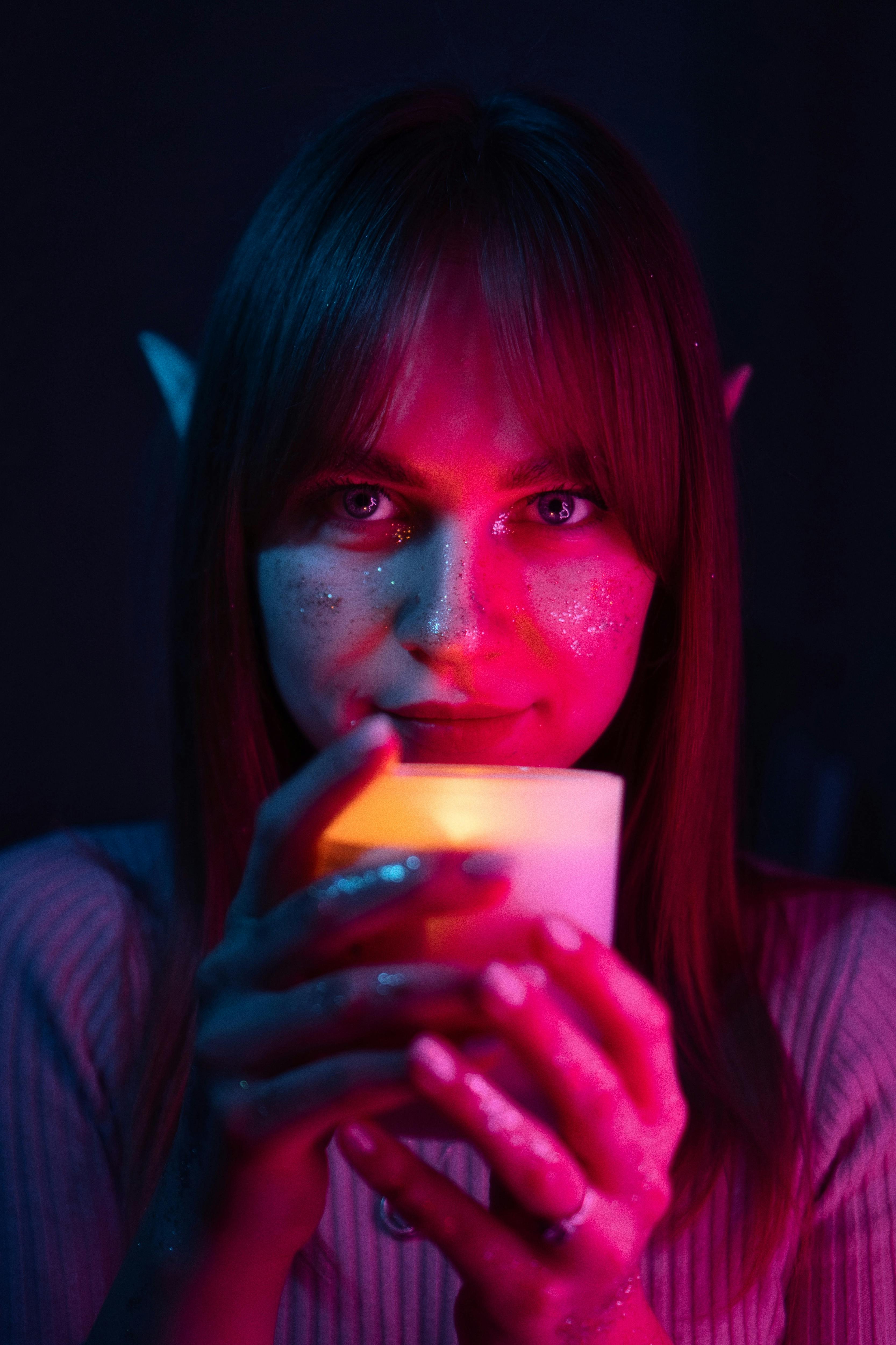 Beautiful Cosplayer Holding Candle in Hand · Free Stock Photo