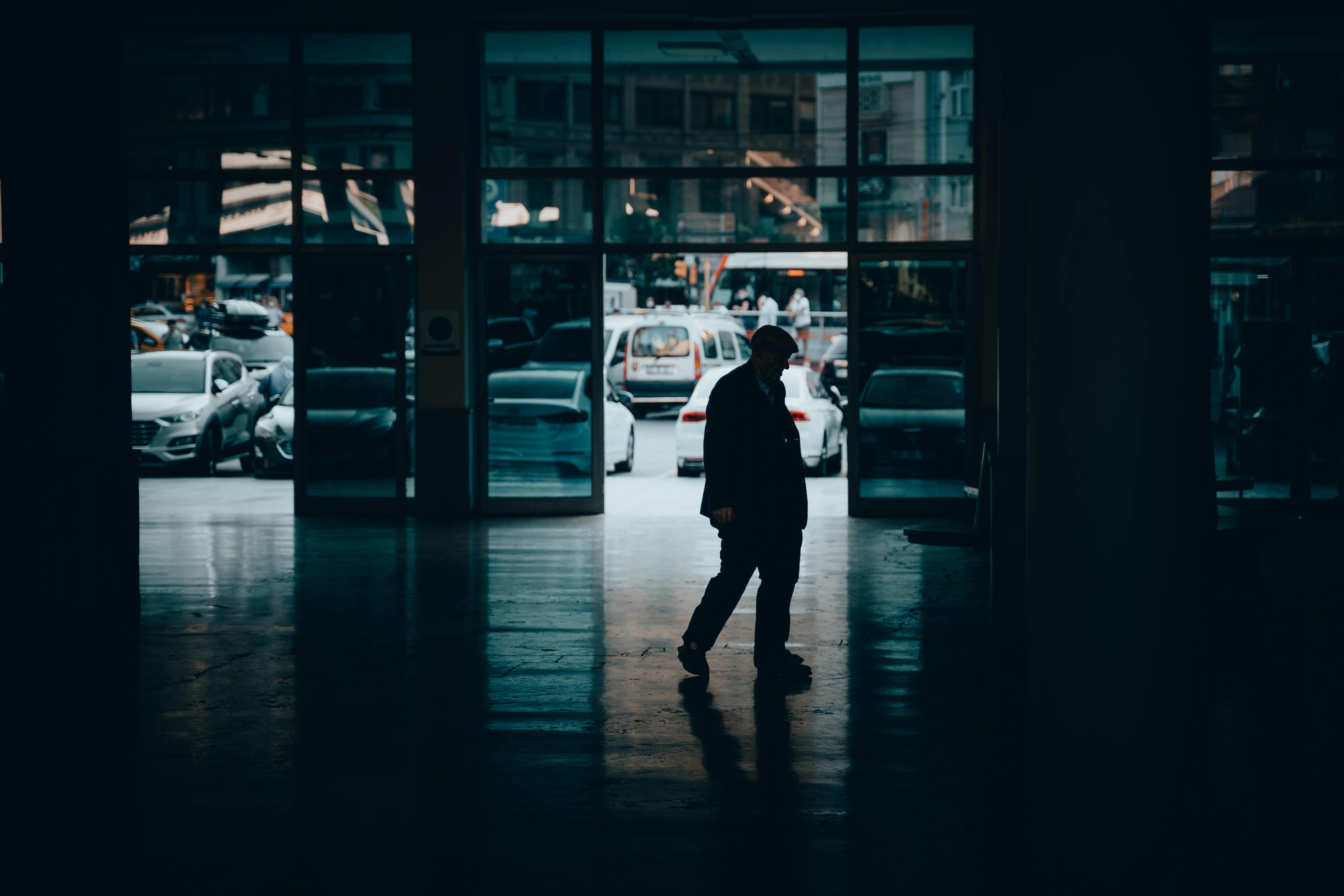 Elderly Man Walking in Hallway · Free Stock Photo