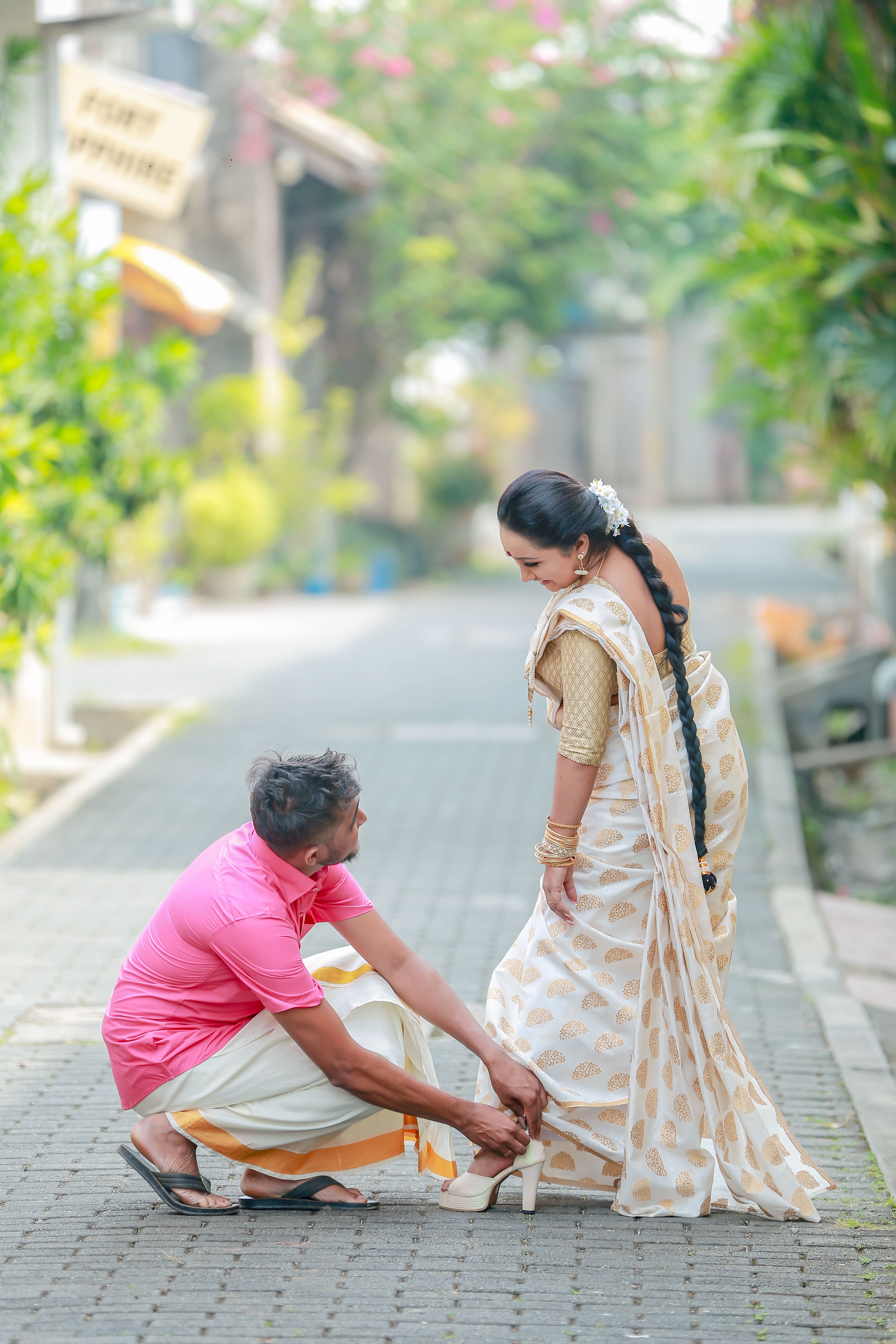 Man Helping Woman on Pavement · Free Stock Photo