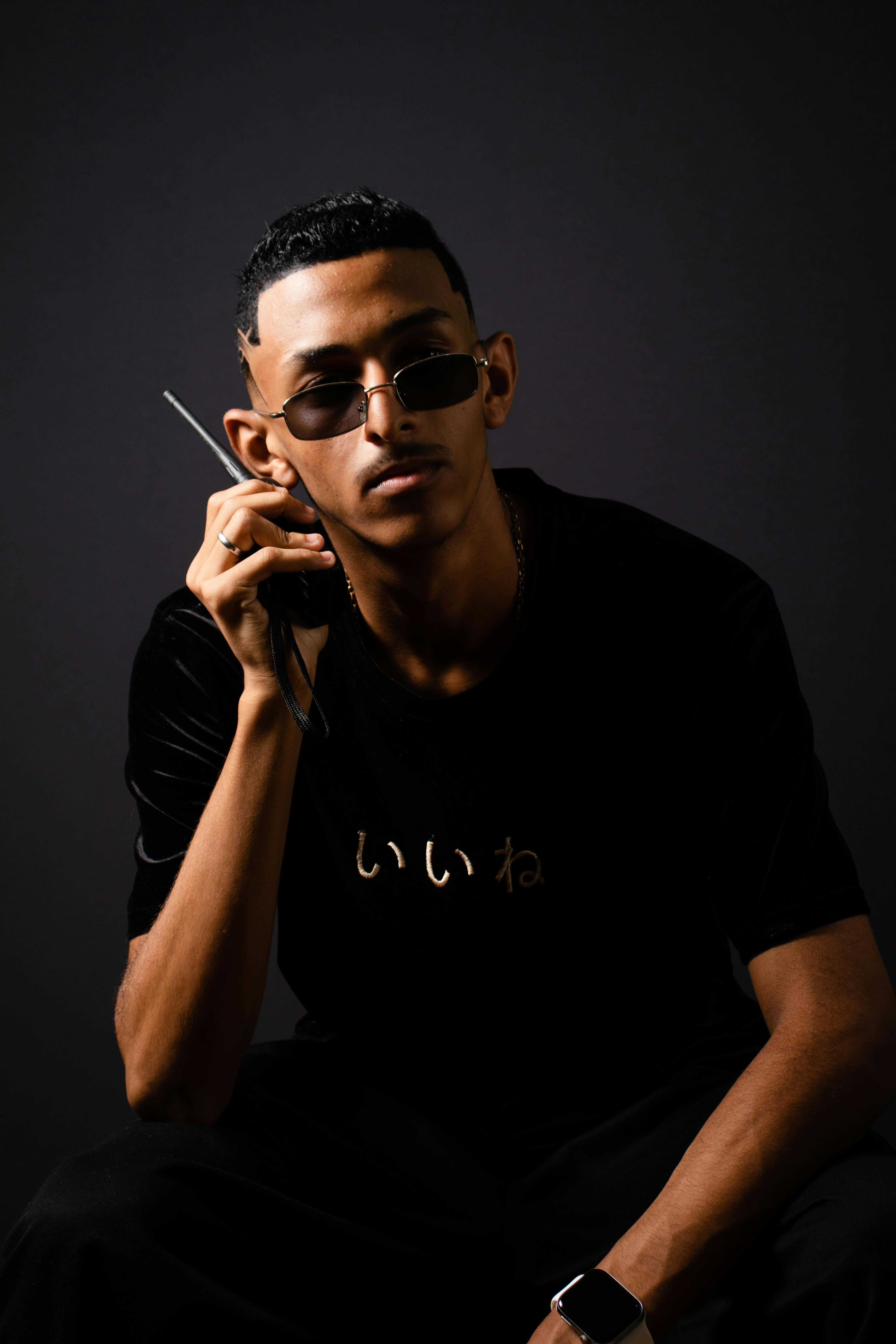 Young Black Man in Traditional Suit Posing in Studio · Free Stock Photo