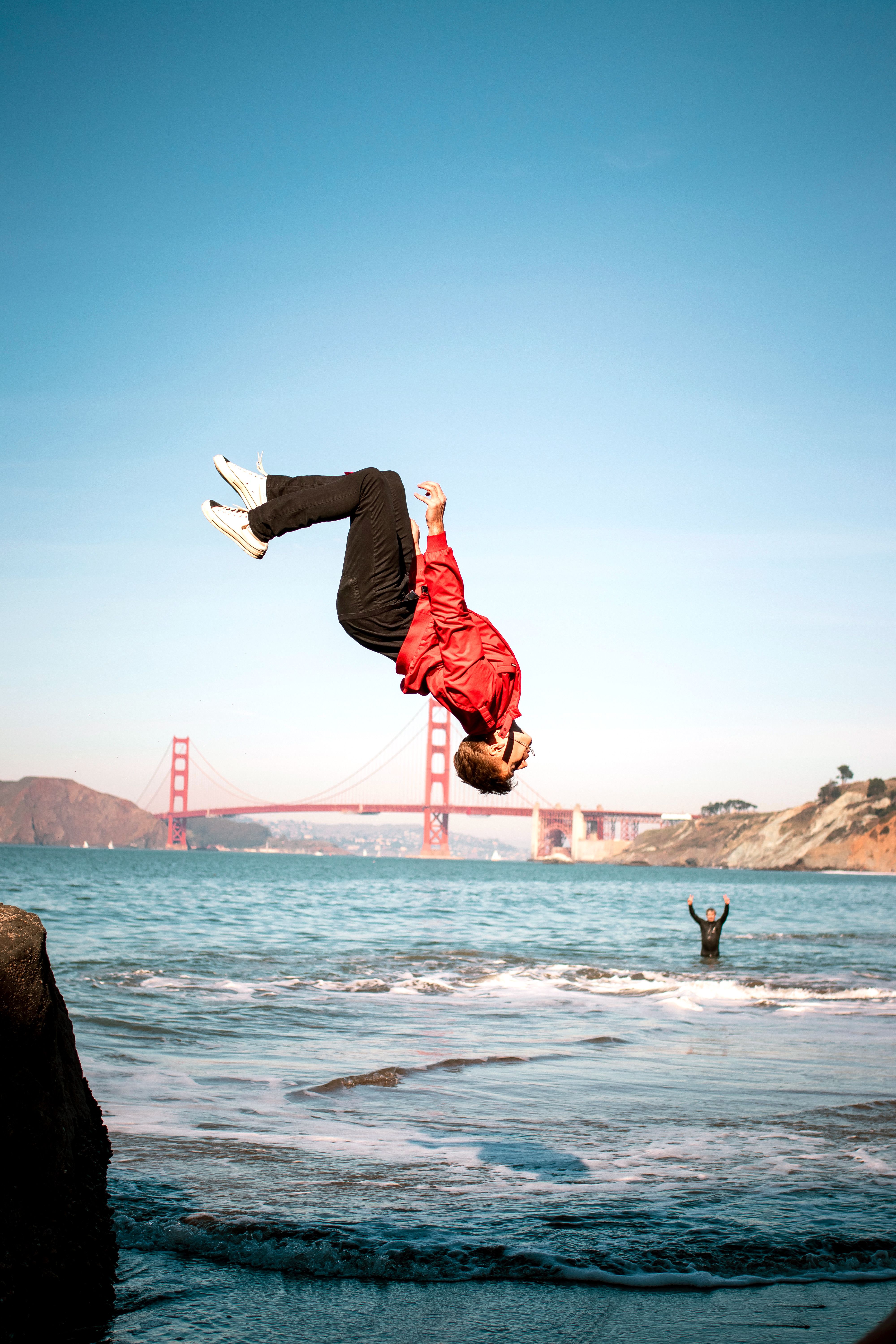 A Man Flipping on Air in the Beach · Free Stock Photo