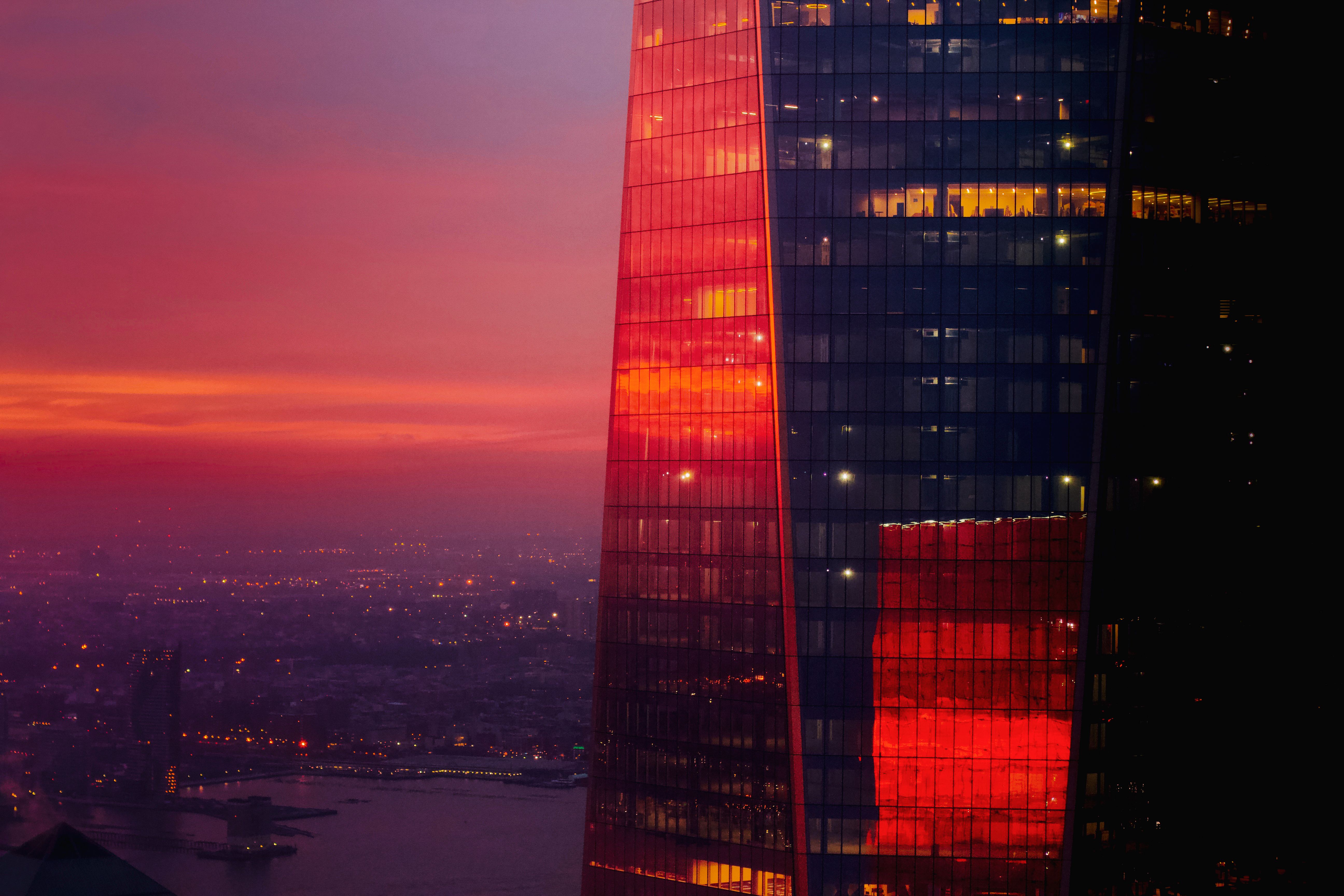 Skyscraper Wall in City at Sunset under Red Sky · Free Stock Photo