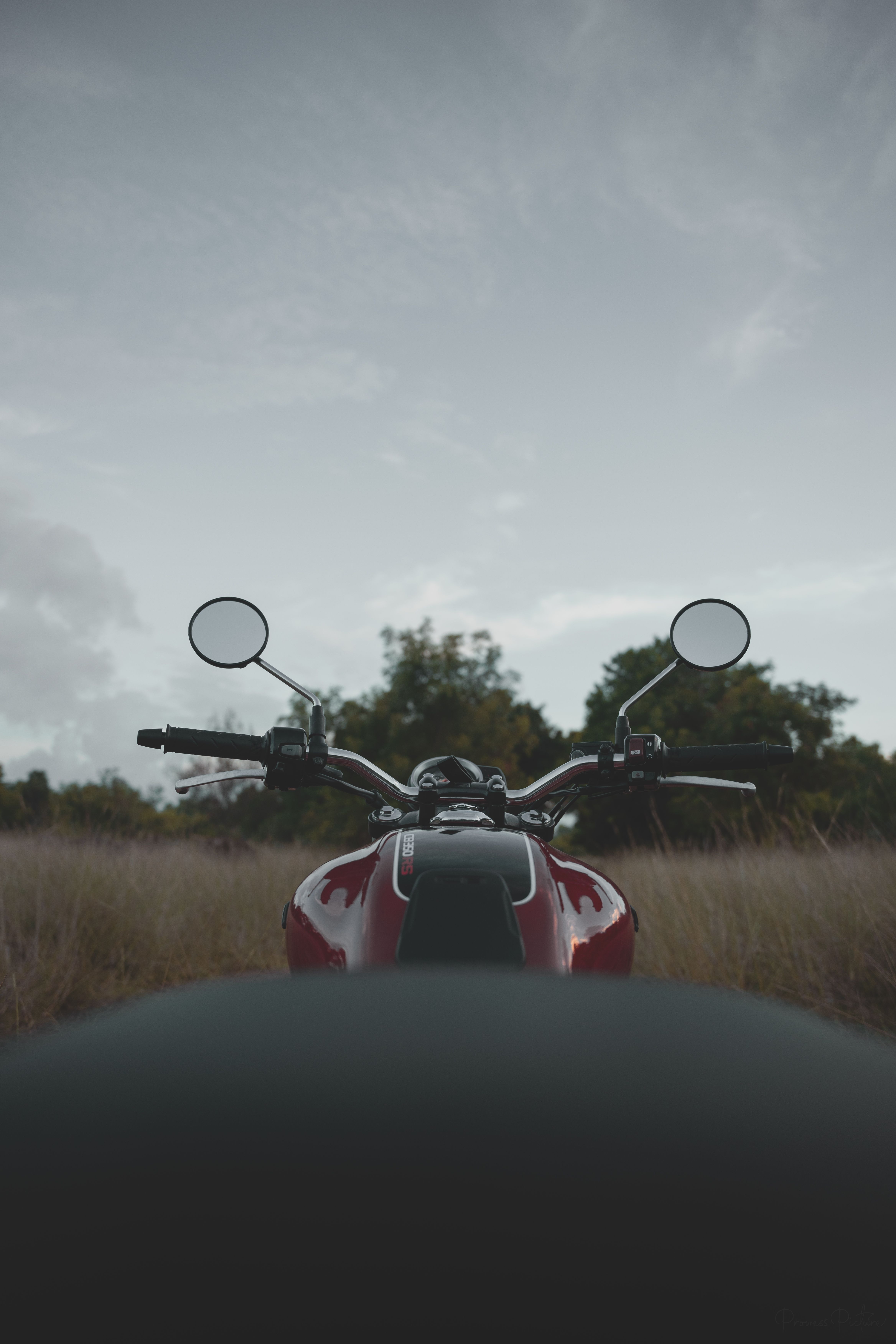 A Motorcycle on a Grass Field · Free Stock Photo