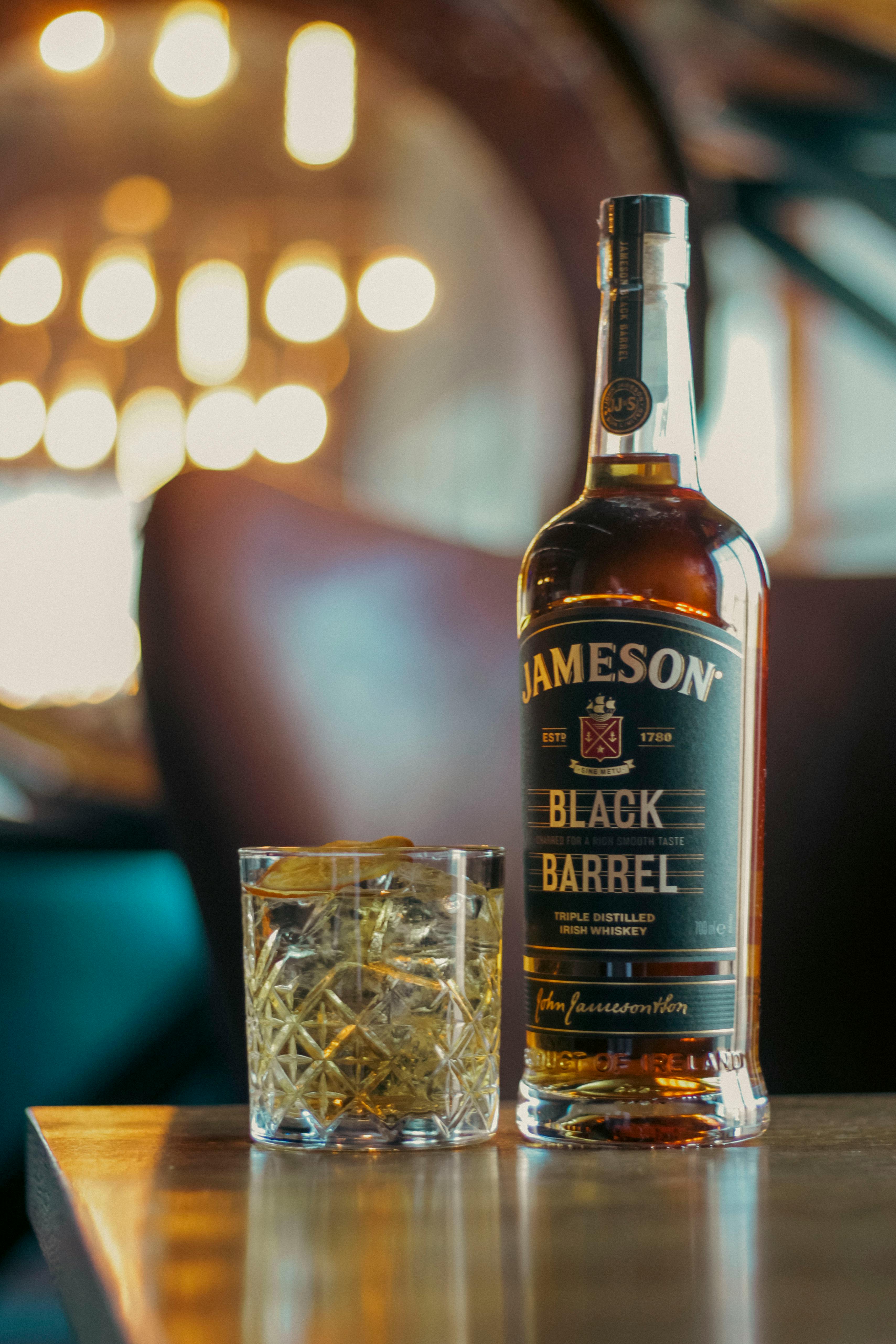 Closeup Photo of Liquor Bottle Against Black Background · Free Stock Photo