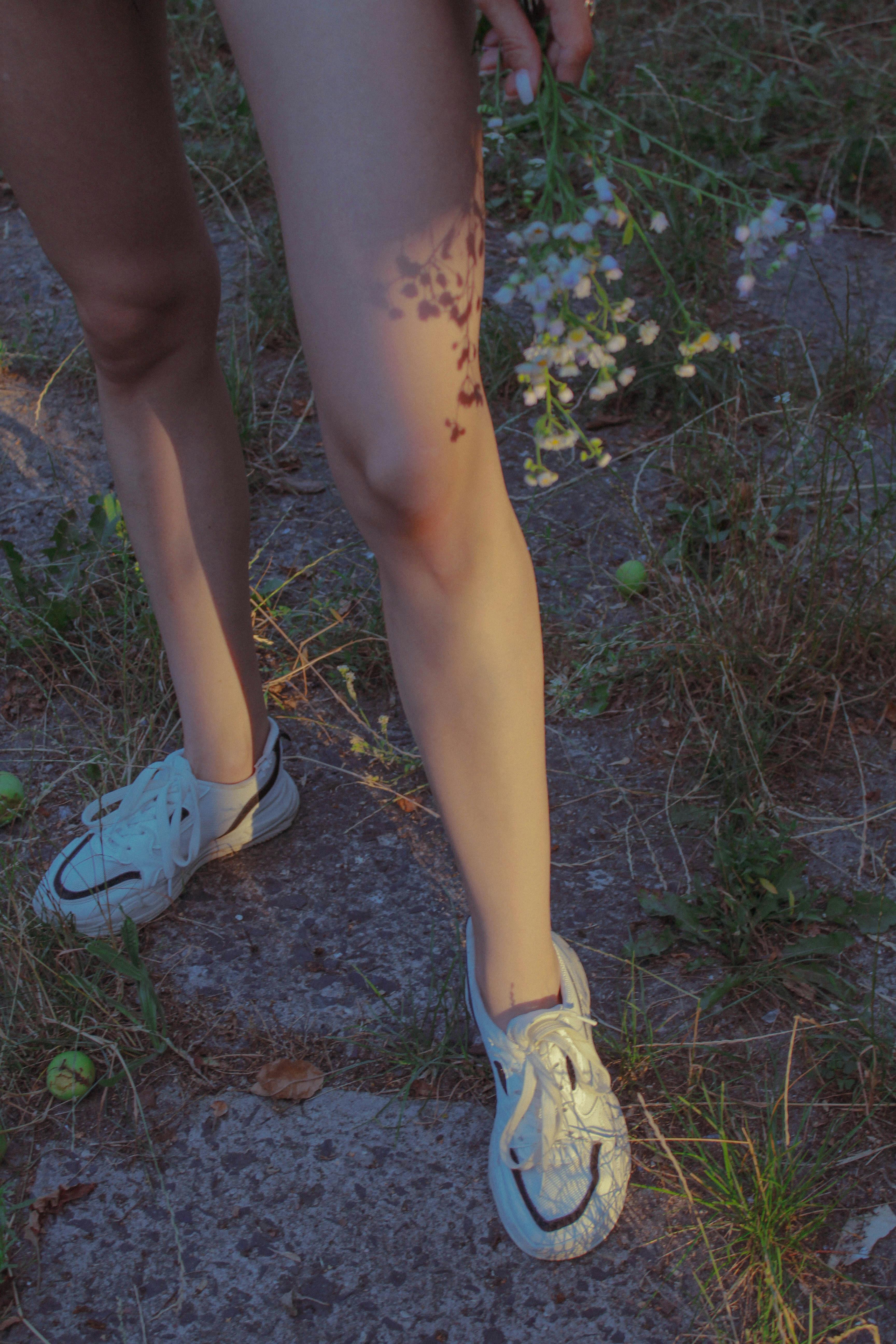 Woman Legs Standing on Ground · Free Stock Photo