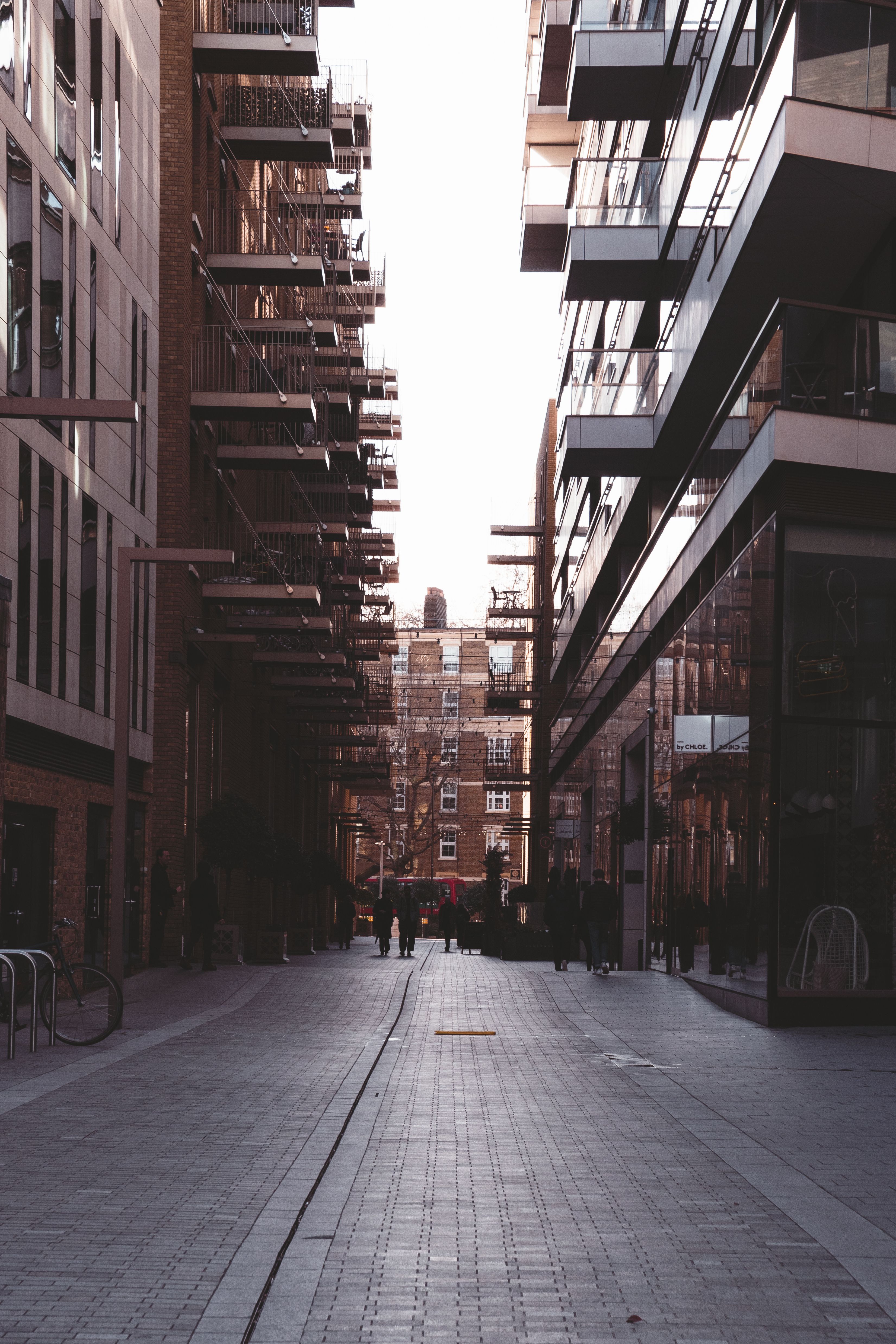 Buildings with Balconies around Alley in Town · Free Stock Photo