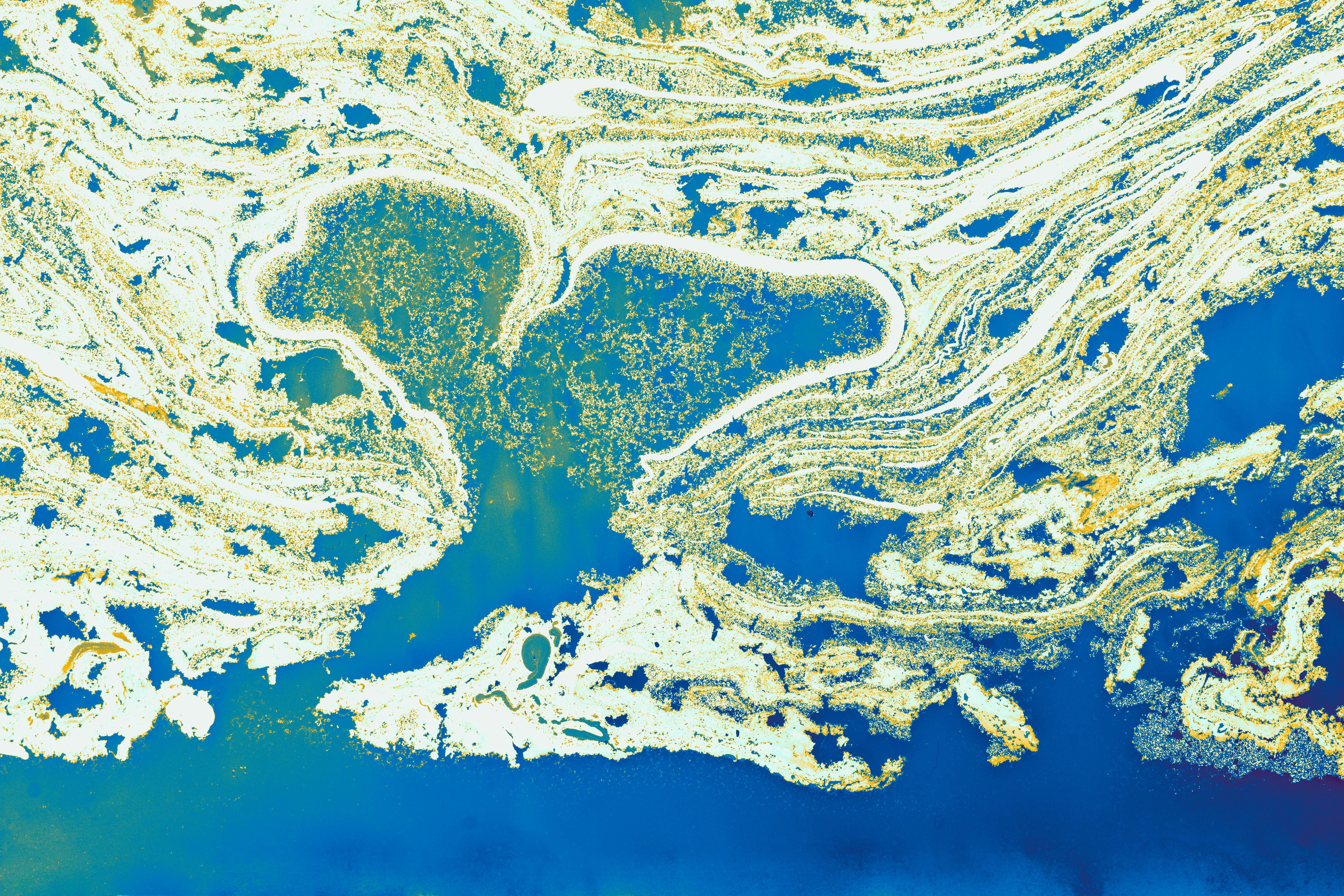 A satellite image of the ocean with clouds · Free Stock Photo