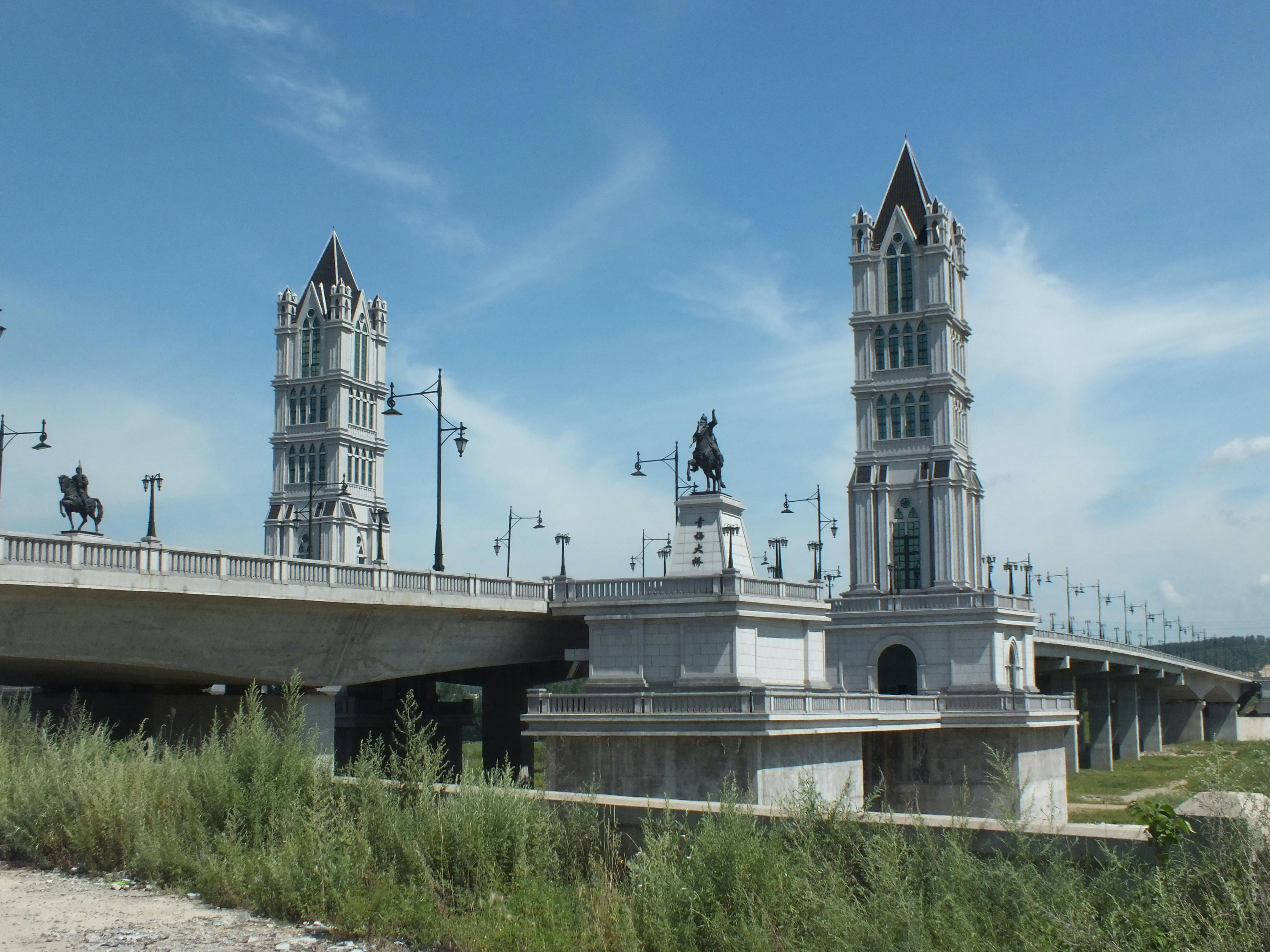 A Bridge with Towers and Equestrian Statues · Free Stock Photo