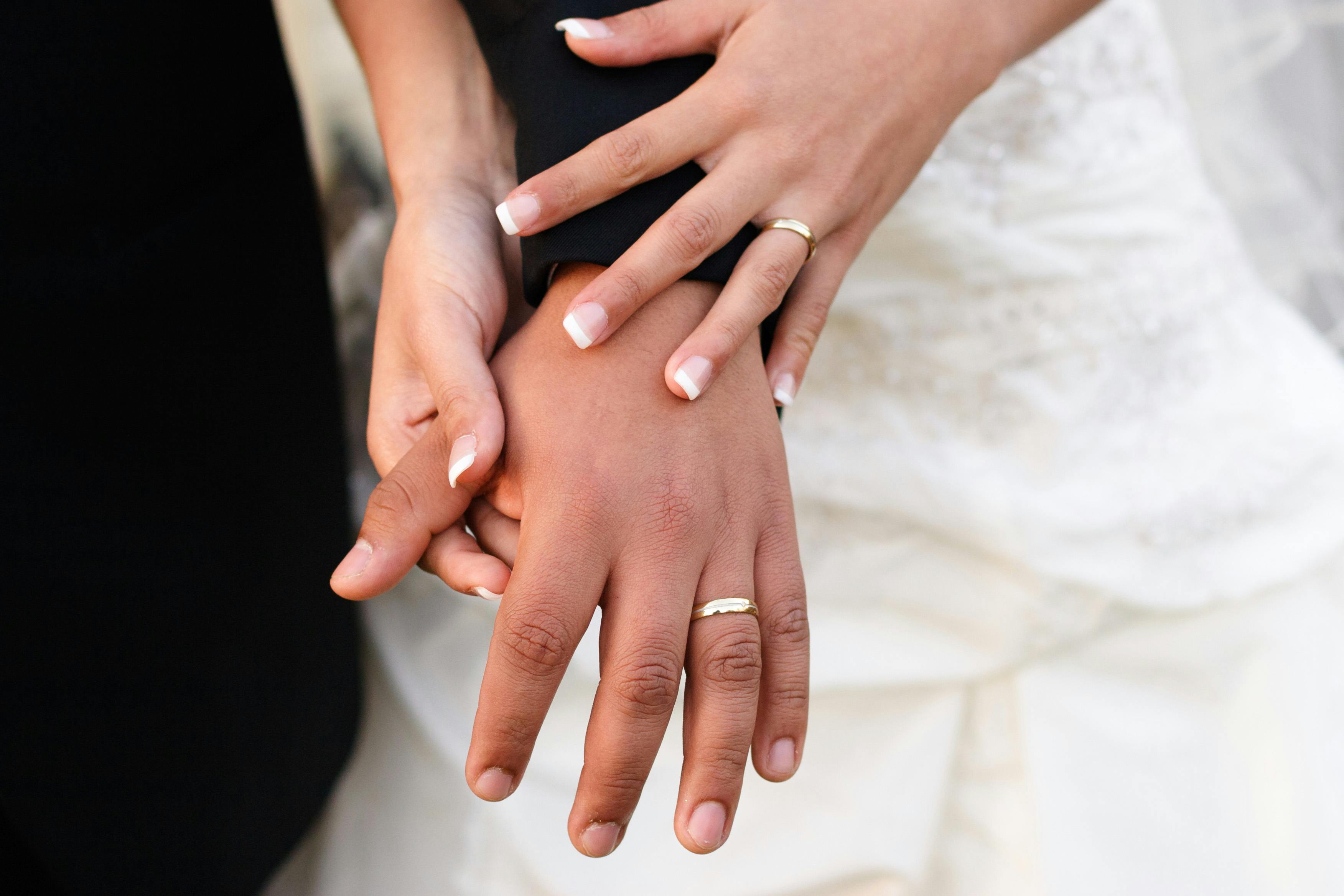 Hands with Wedding Rings · Free Stock Photo