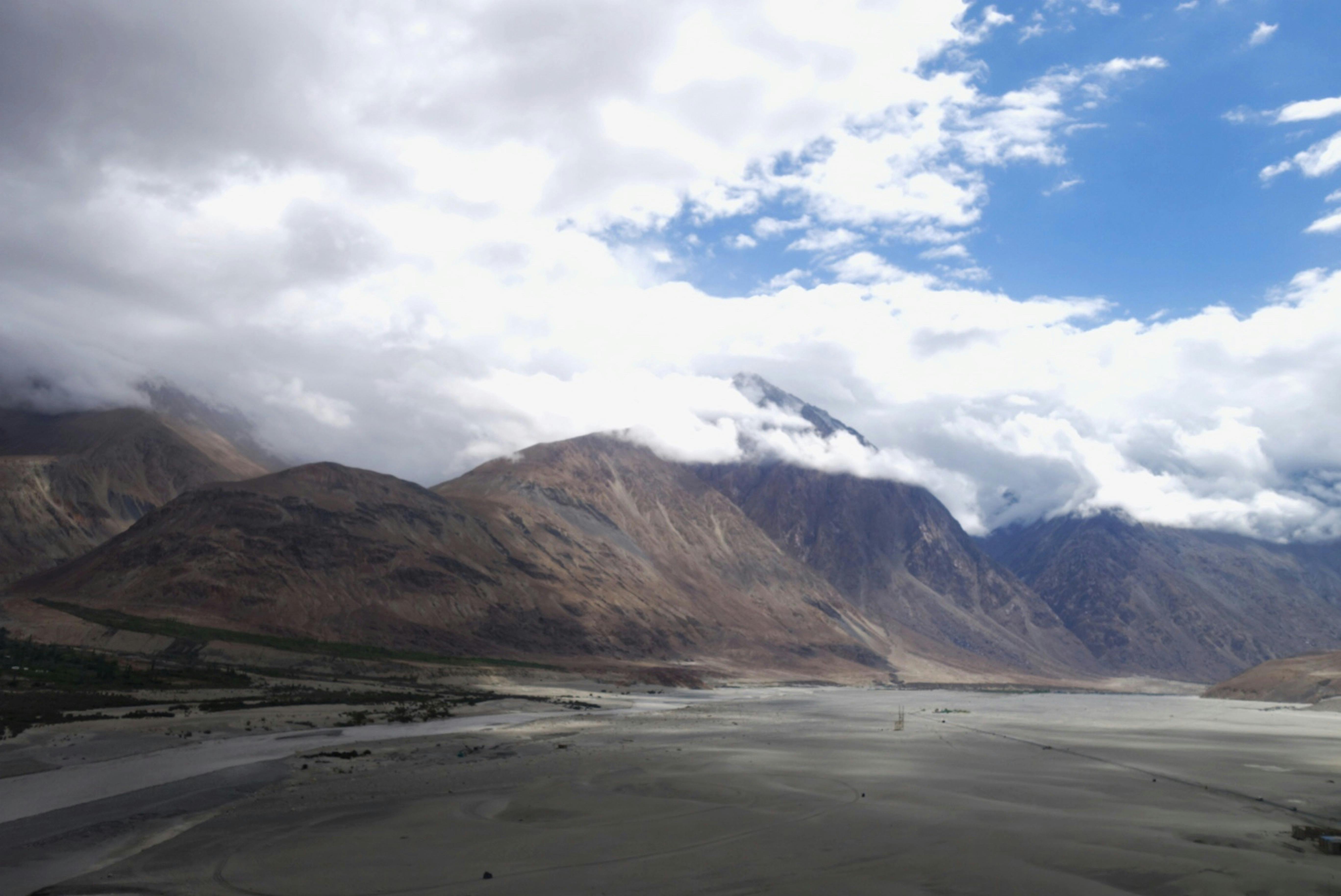 Scenic Heavy Clouds over Mountains · Free Stock Photo