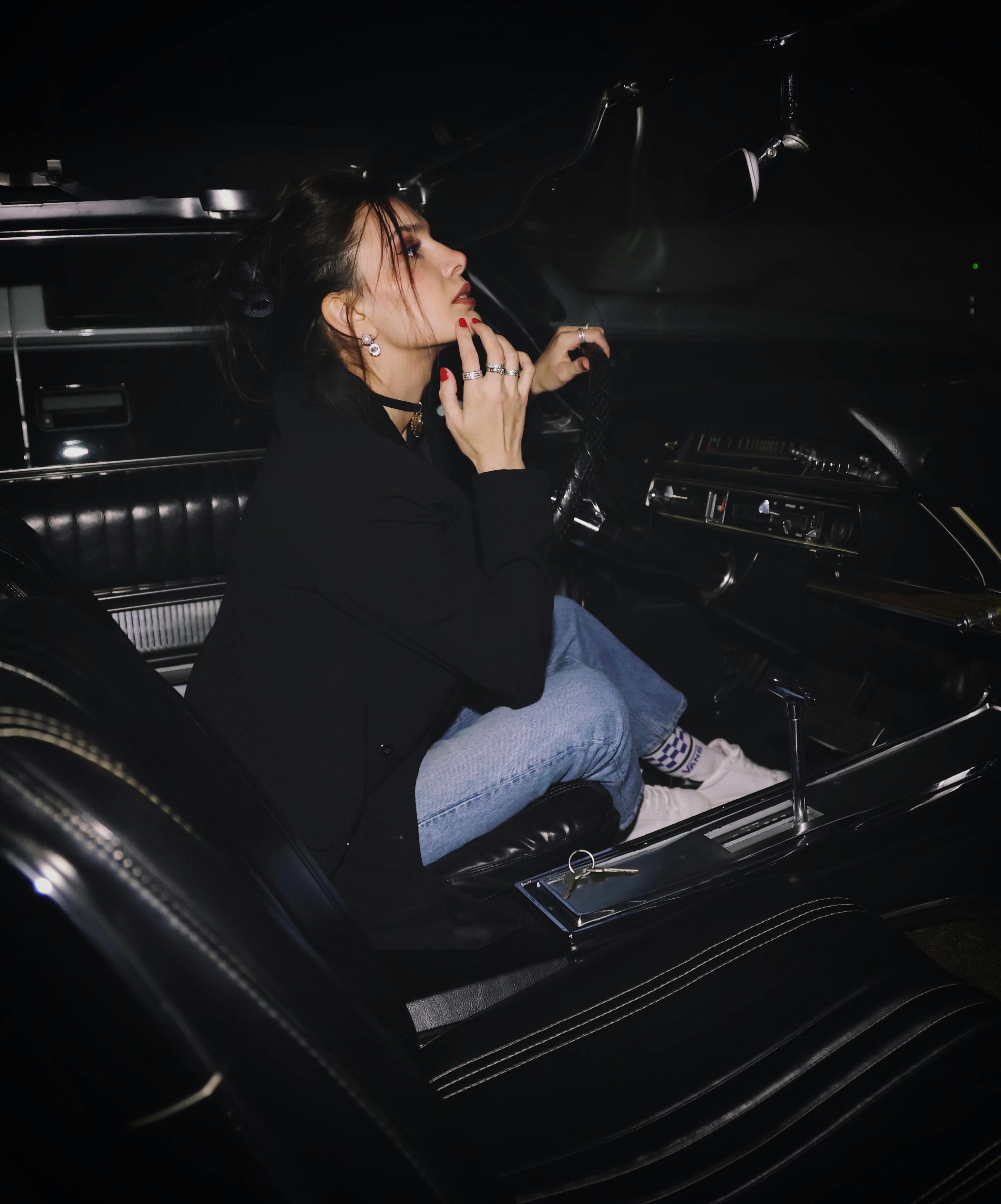 Woman Looking in the Back View Car Mirror · Free Stock Photo