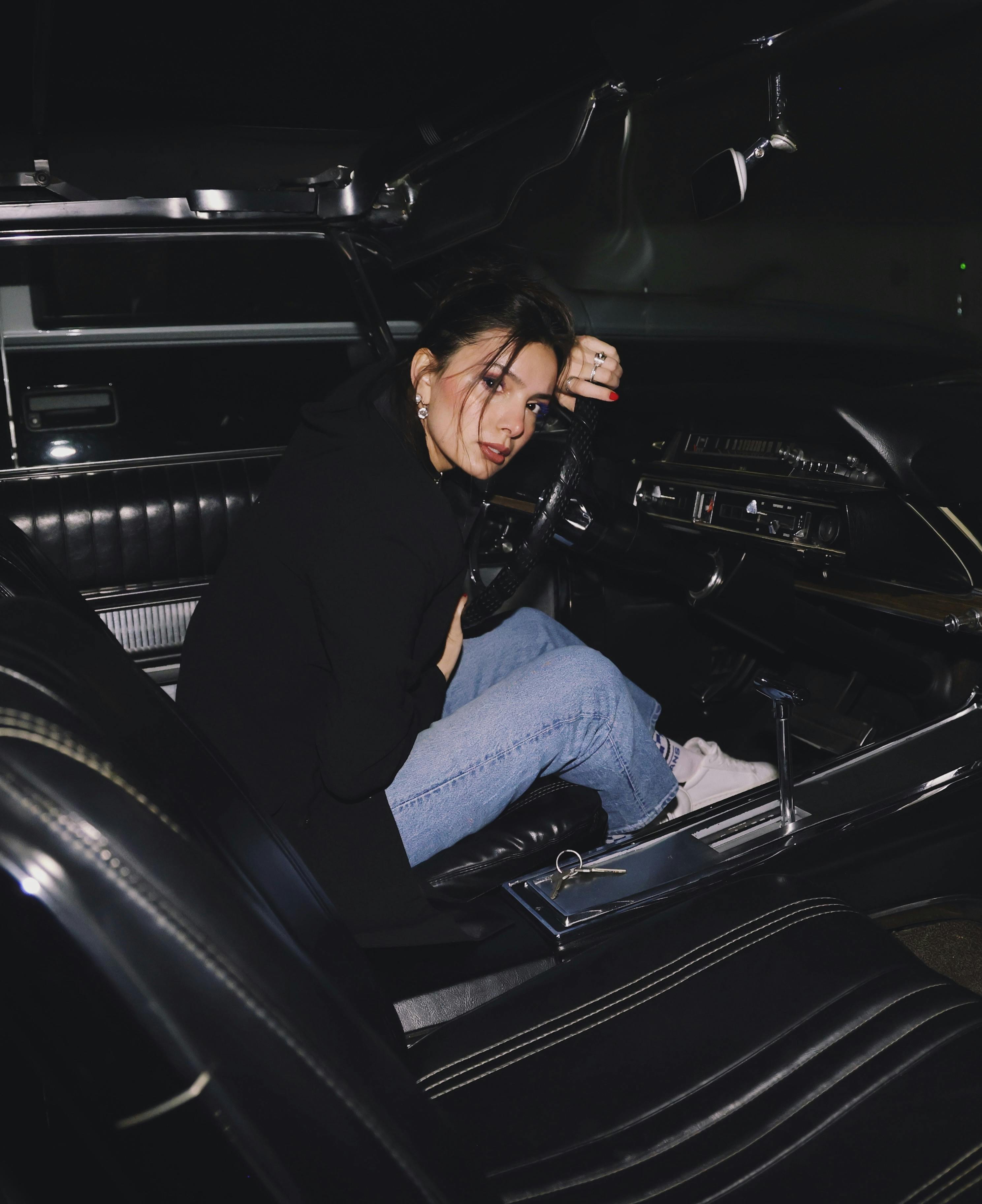 Woman Sitting in Luxury Car · Free Stock Photo