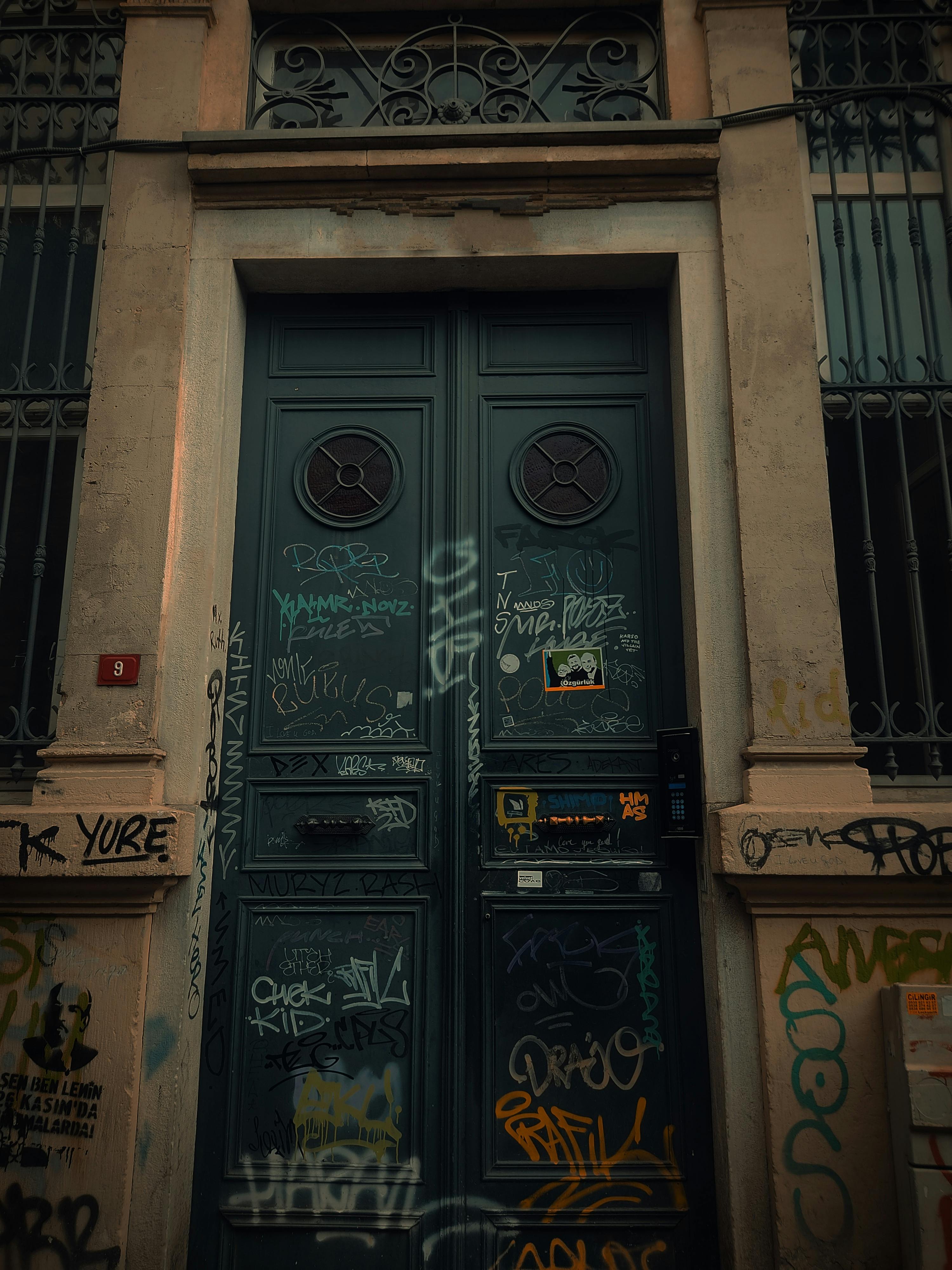 Photo of a Door with Graffiti · Free Stock Photo