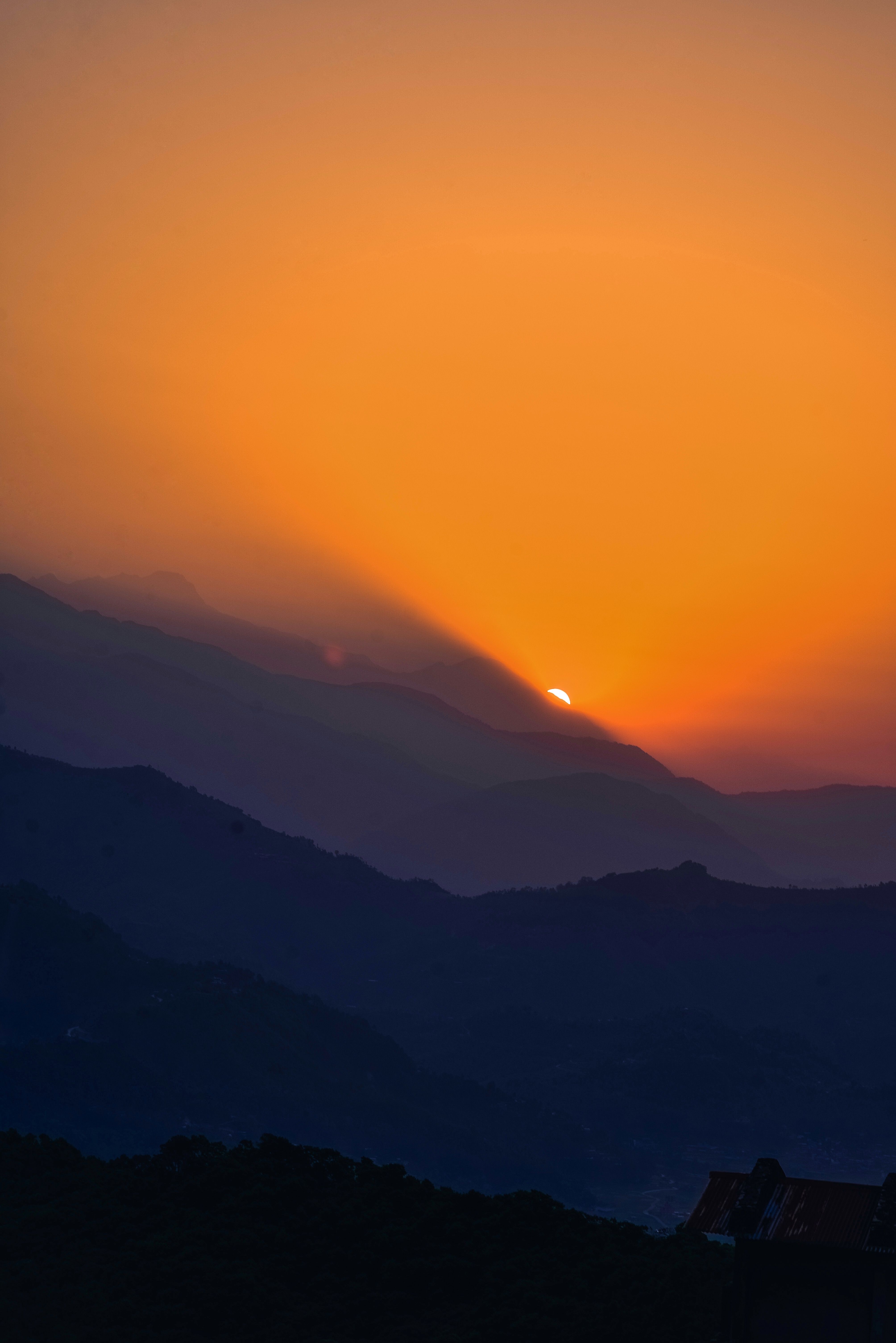 The Sun Setting Behind the Mountain · Free Stock Photo
