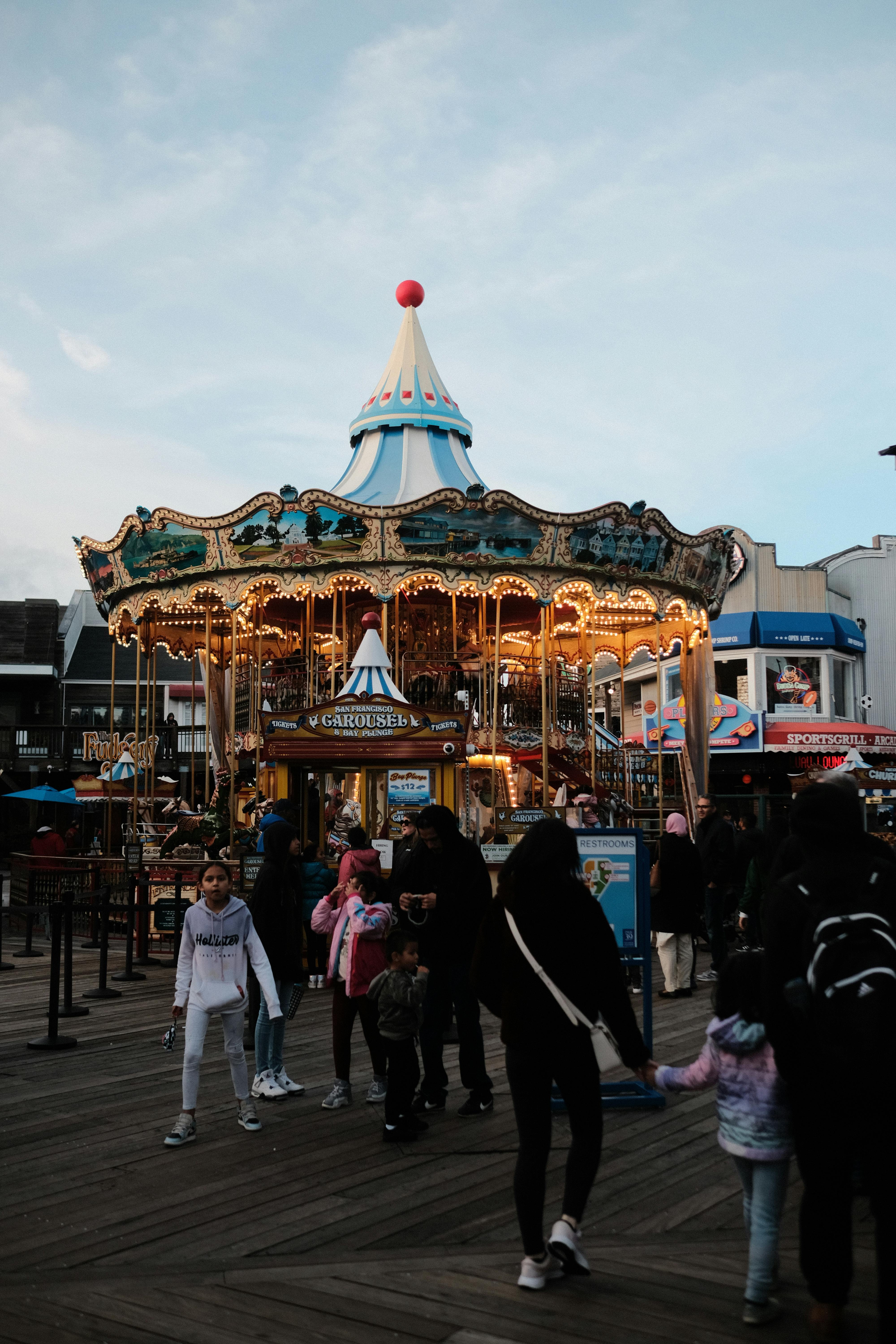 People riding chain carousel in amusement park · Free Stock Photo