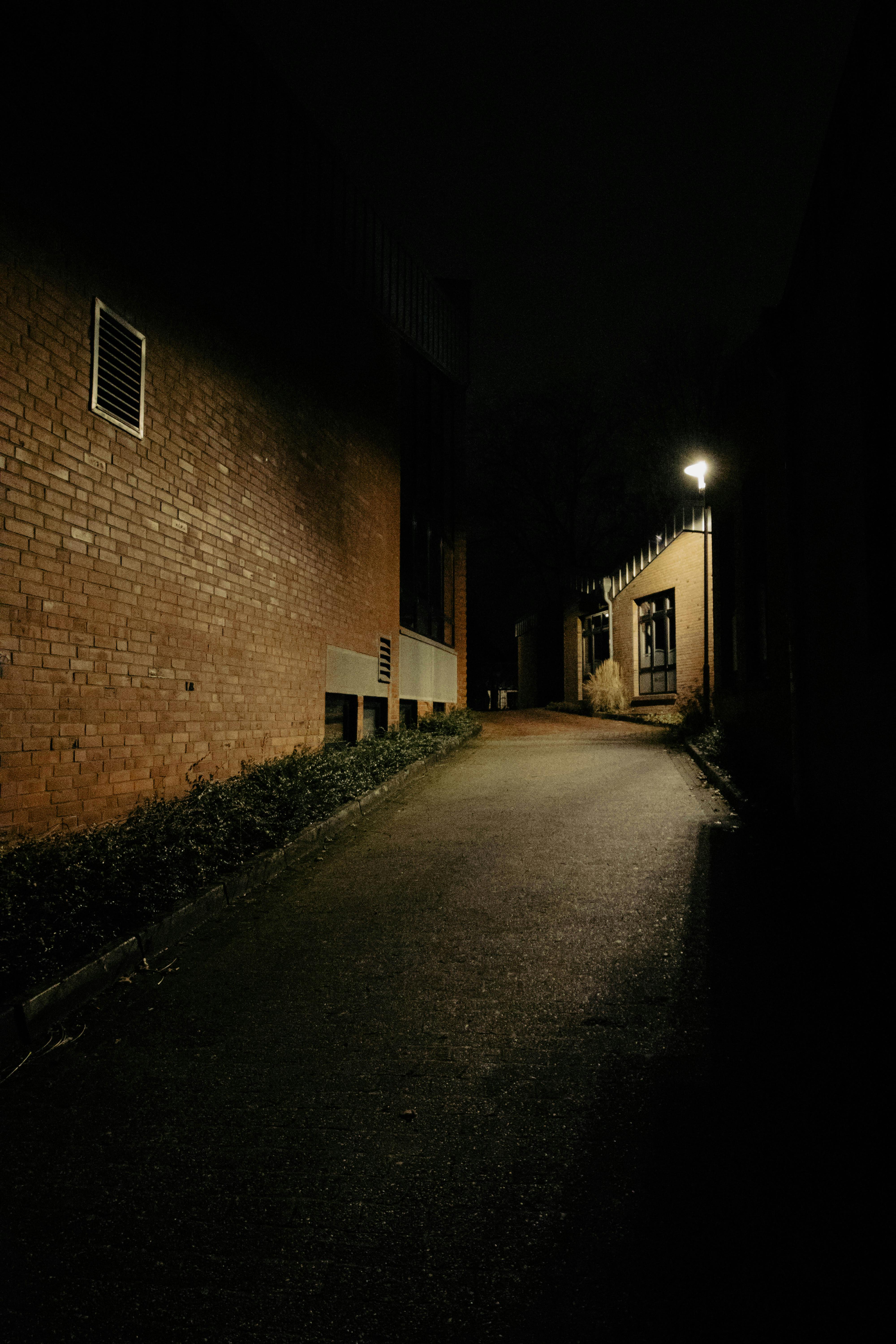 Illuminated Empty Alley at Night · Free Stock Photo