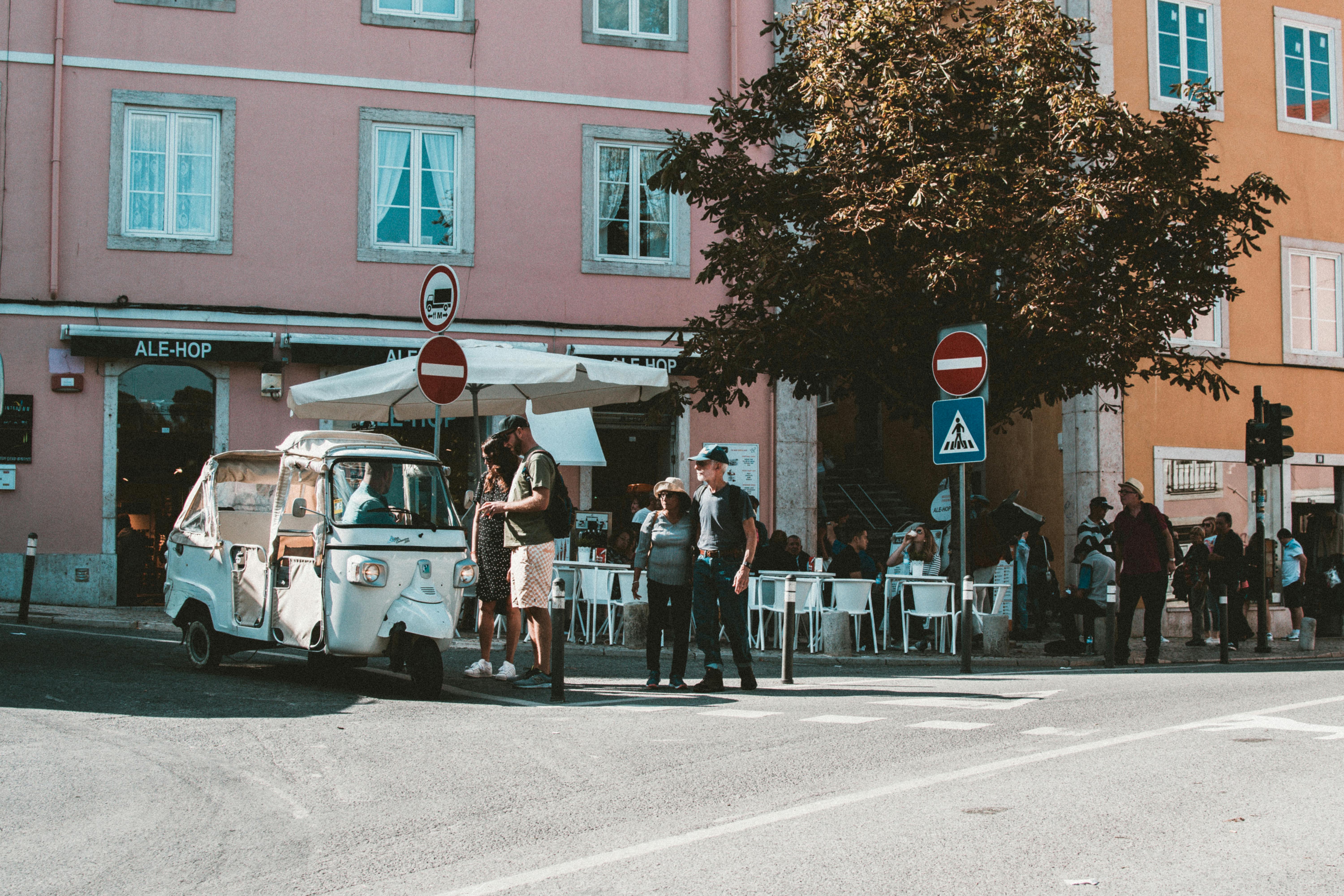 People at the Street Near White Auto Rickshaw · Free Stock Photo