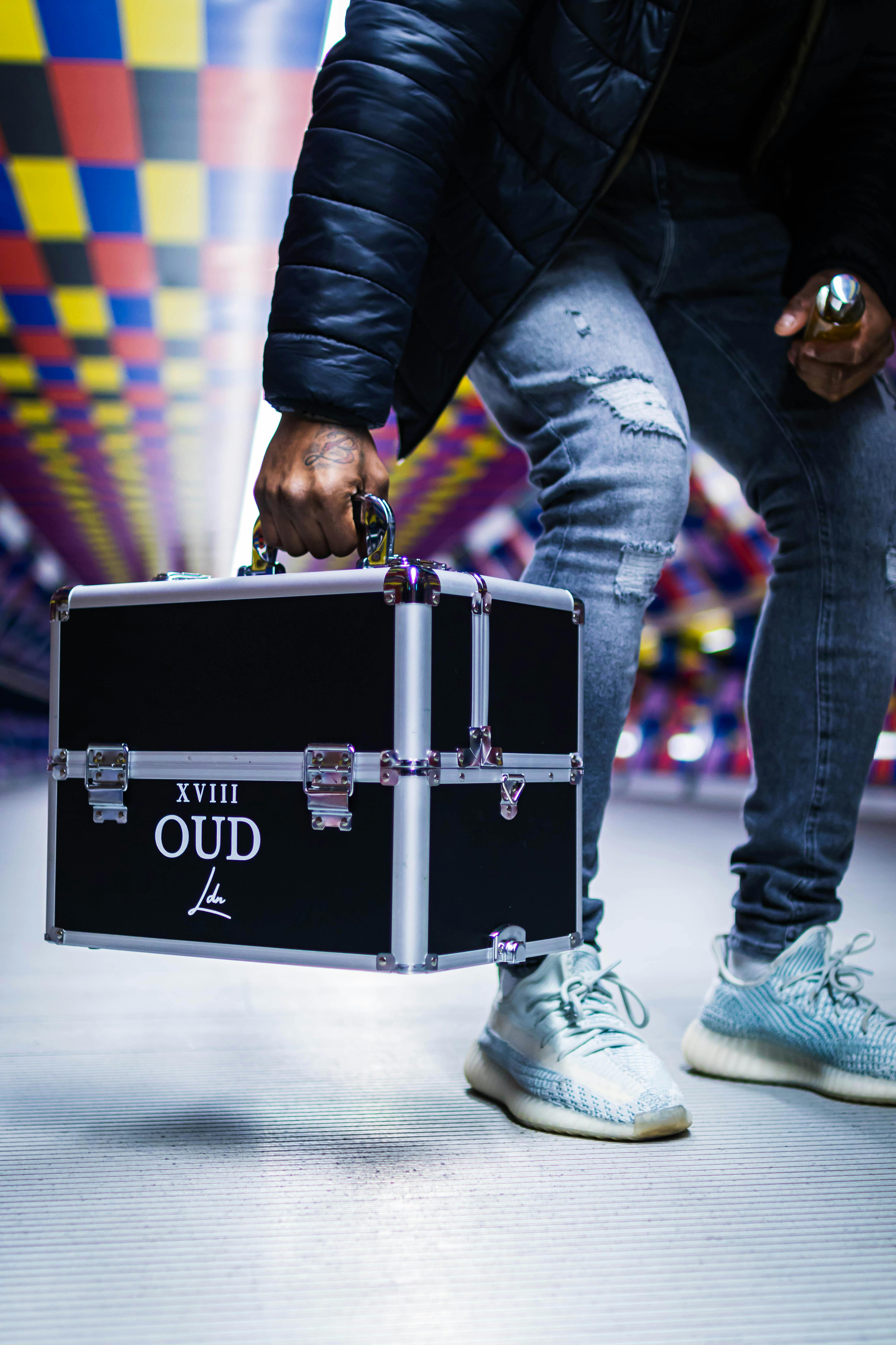 Man Carrying Metal Trunk · Free Stock Photo