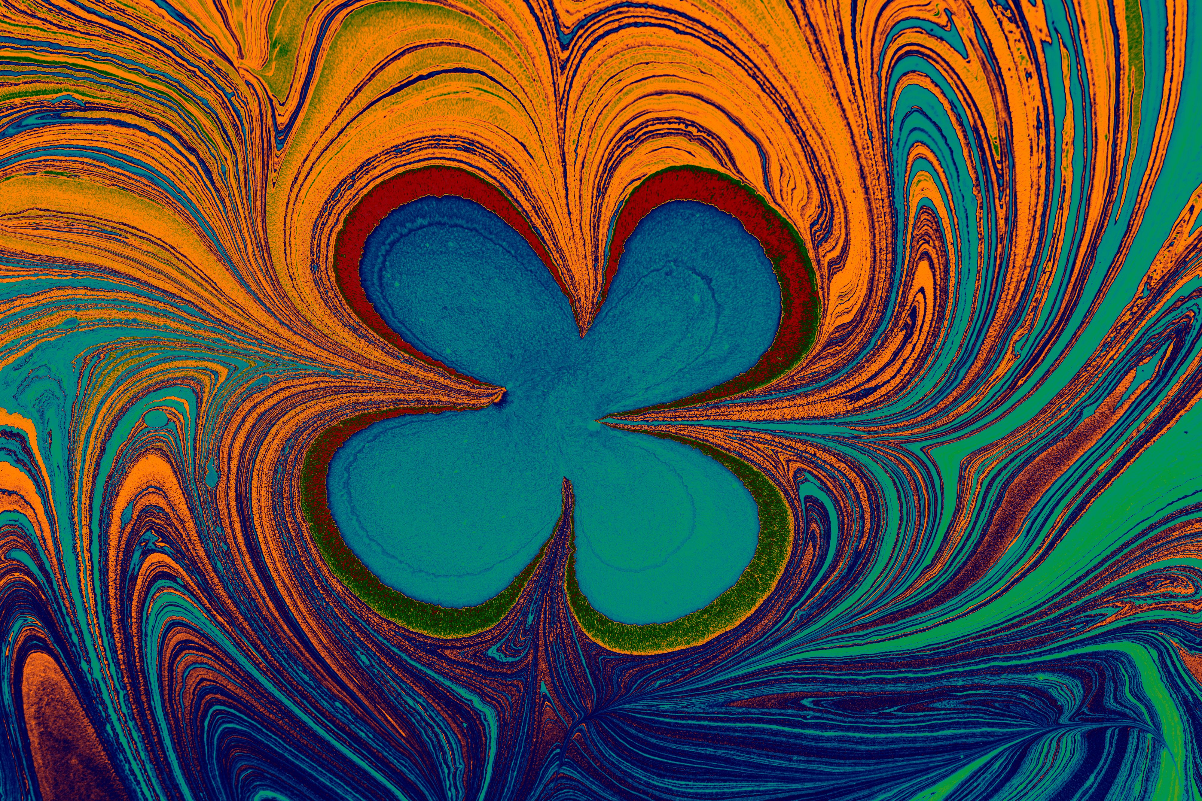 A colorful abstract painting with a four leaf clover · Free Stock Photo