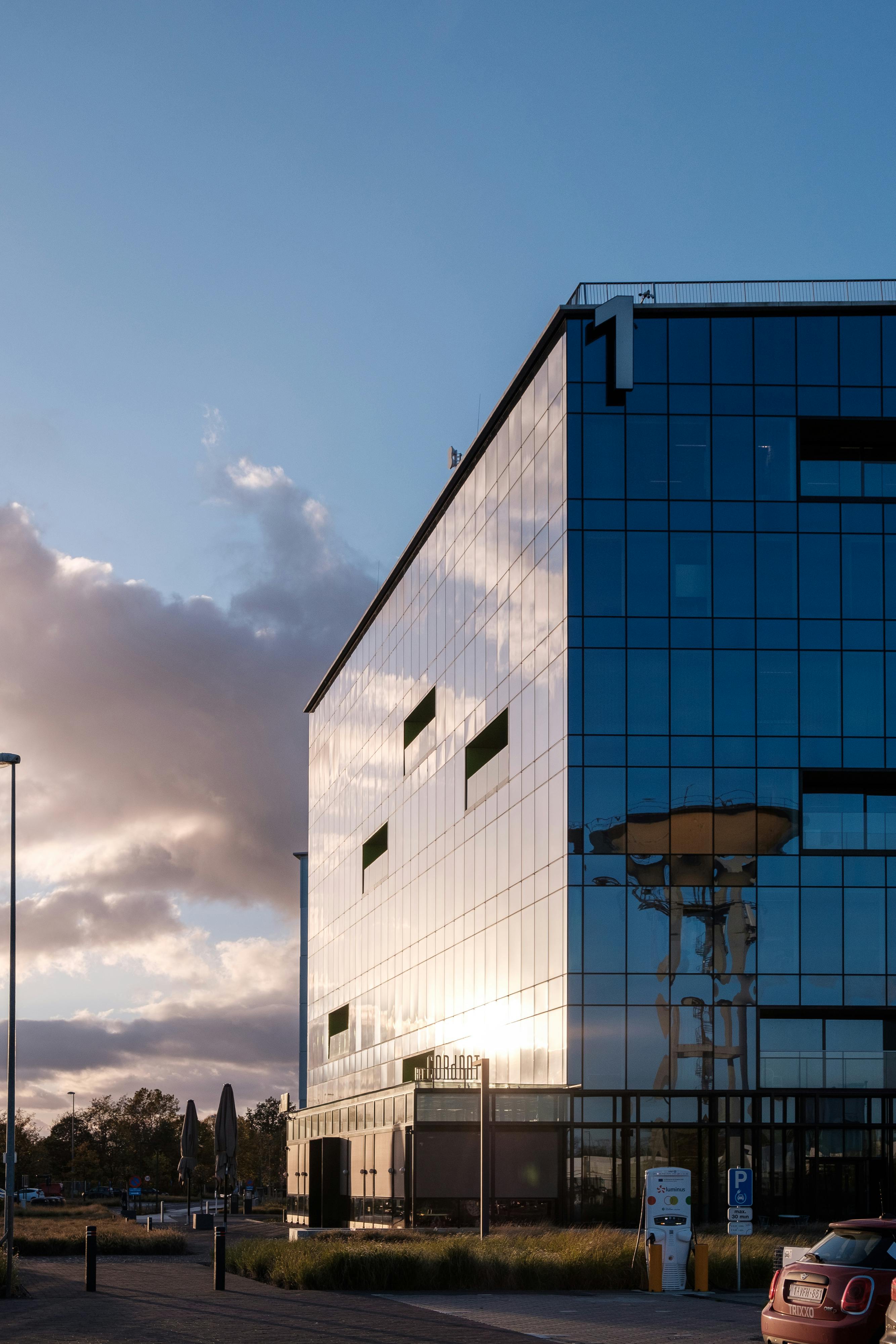 A Woman Standing by a Building · Free Stock Photo