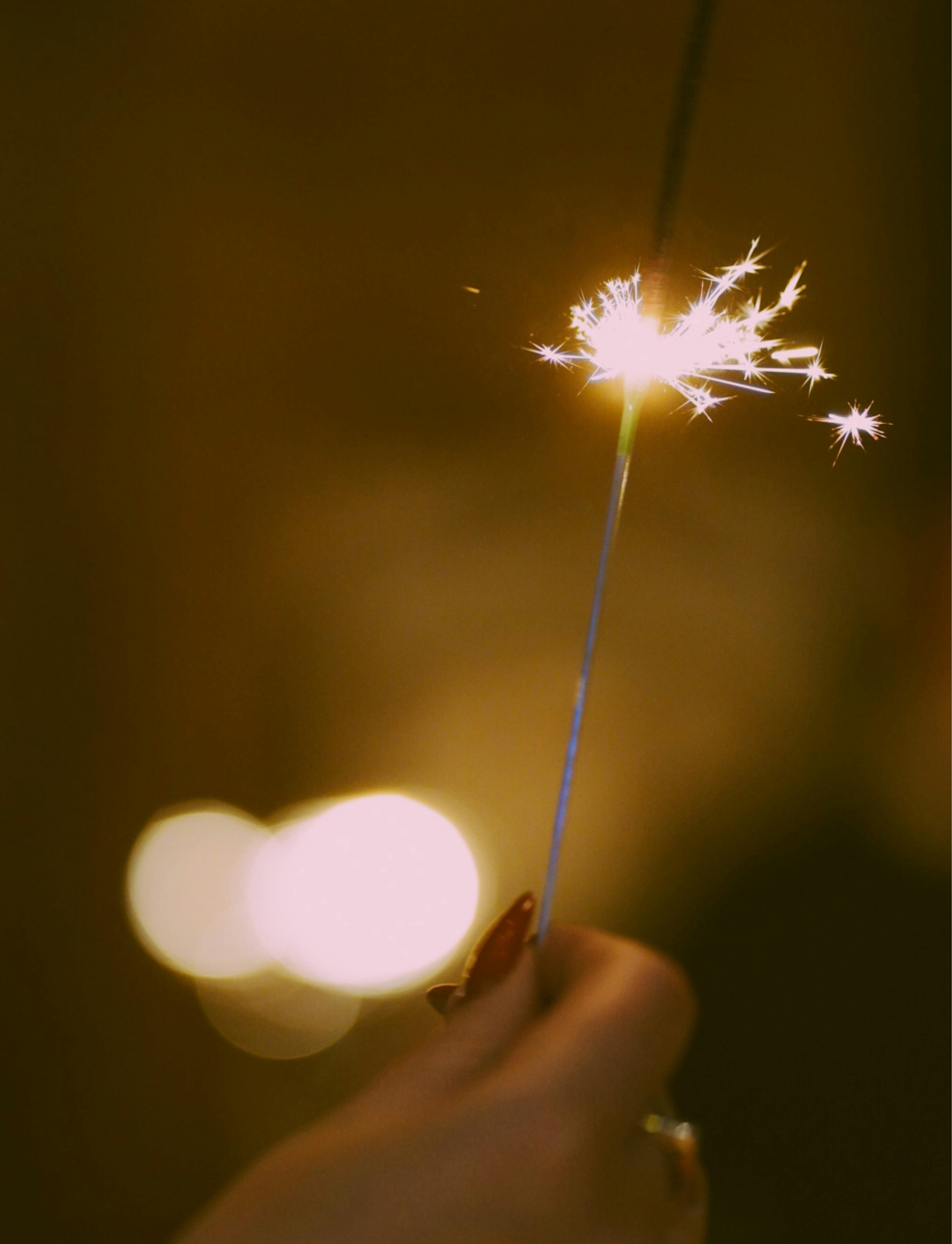 Photo of a Person's Hand Holding Firecracker · Free Stock Photo