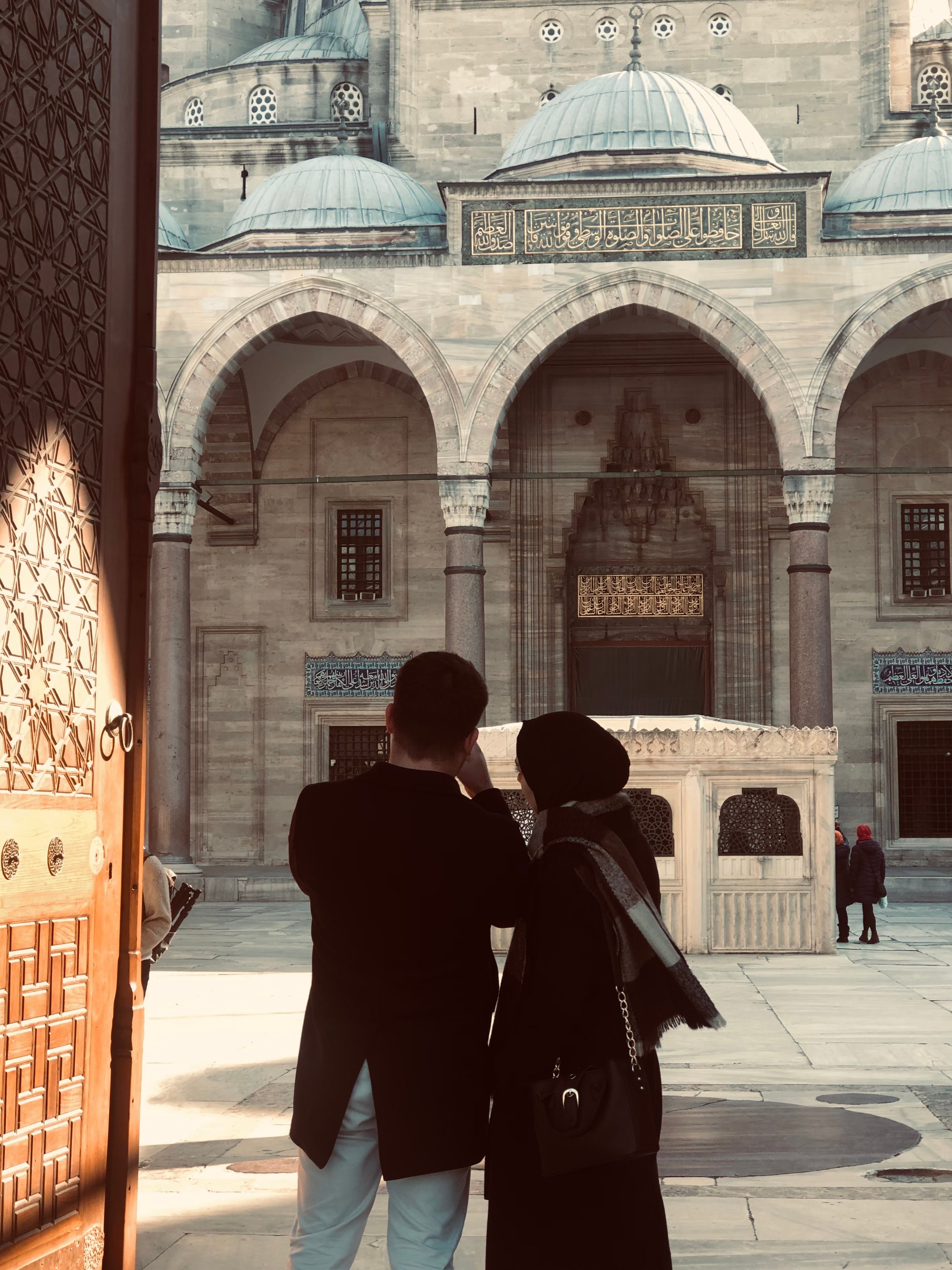 Man in Traditional Thawb Robe and Imamah Kufi Cap Walking Along the ...