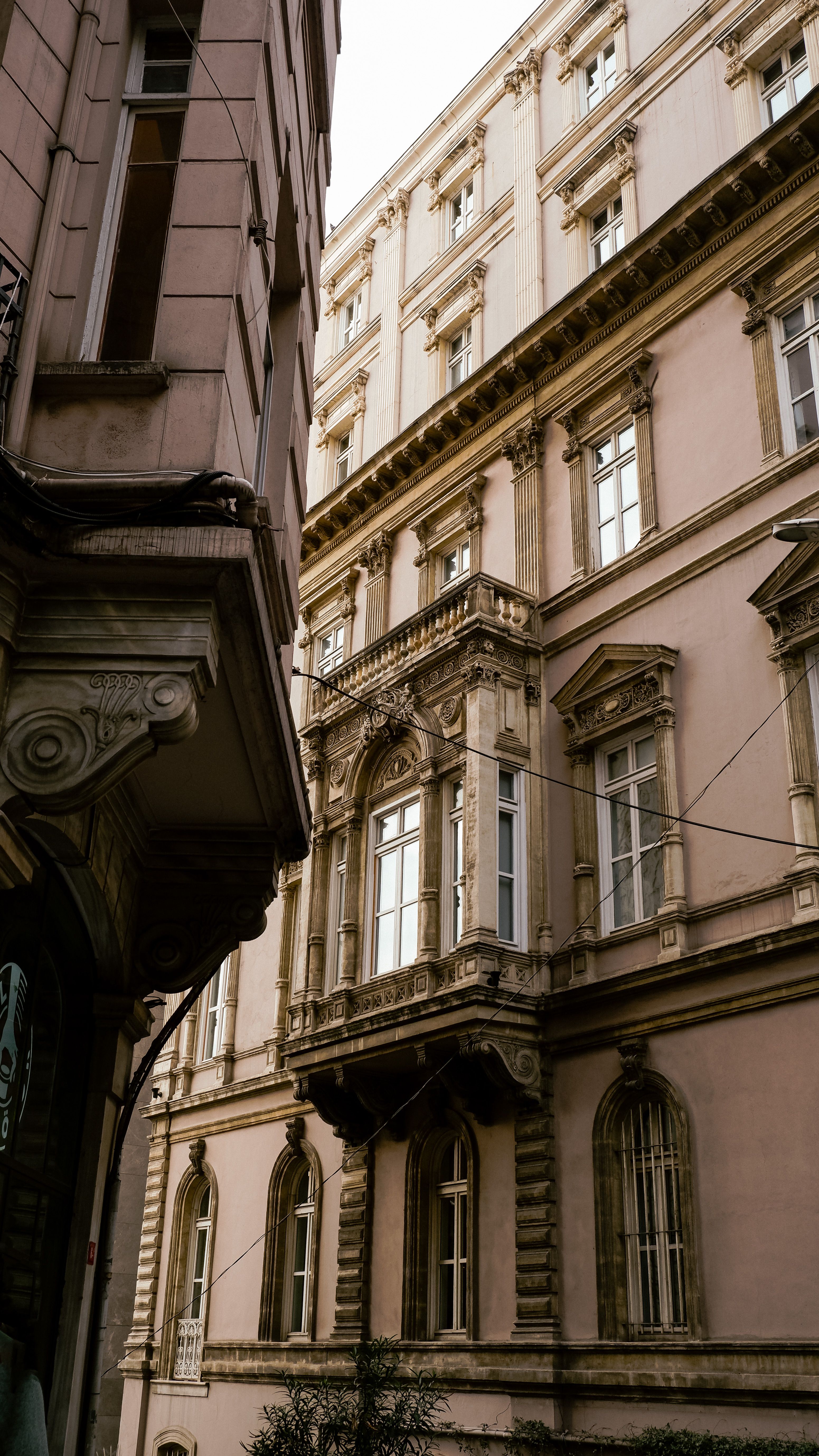 Low-Angle Shot of Beige Concrete Buildings · Free Stock Photo