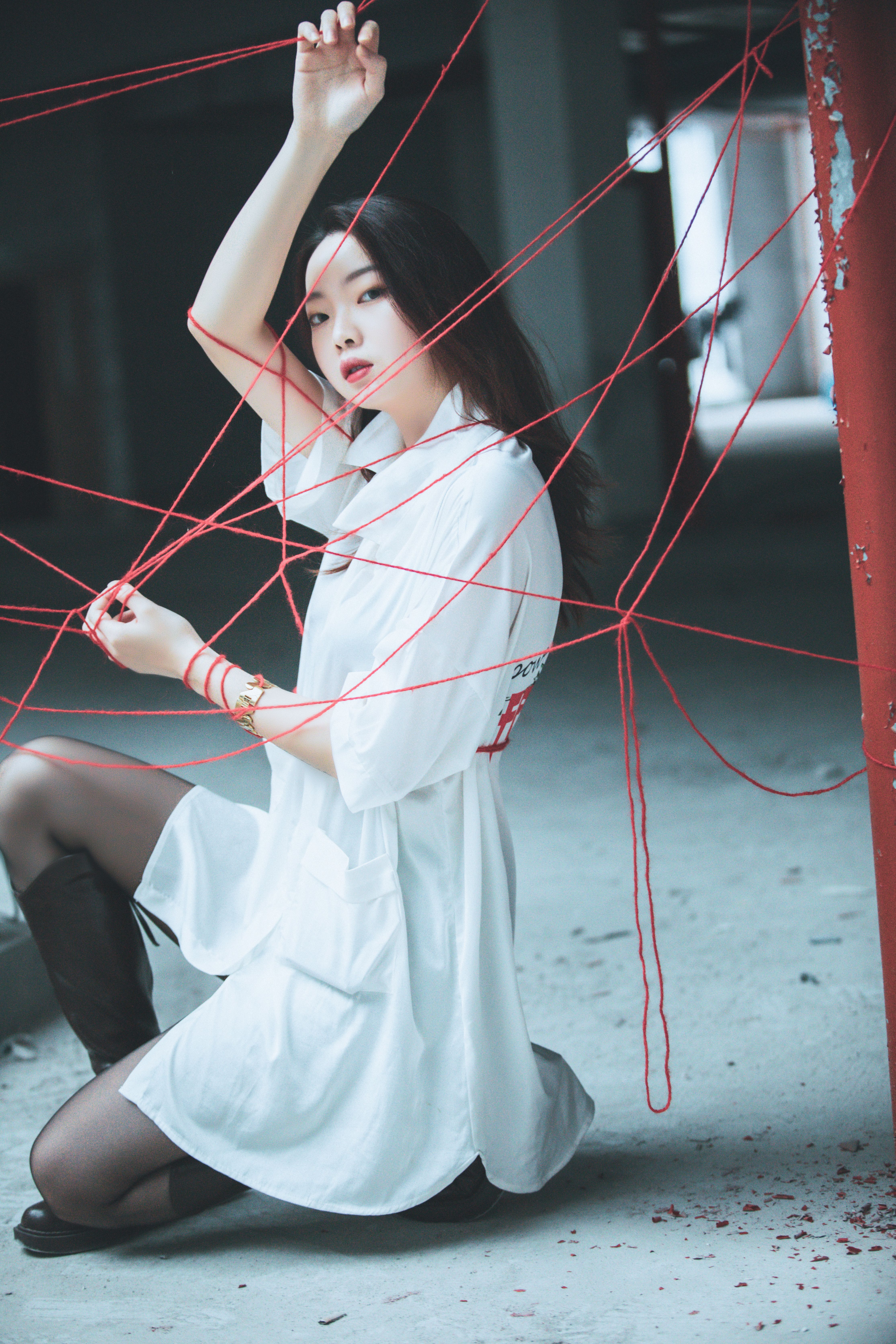 Beautiful Woman in White Dress Posing in Red String · Free Stock Photo