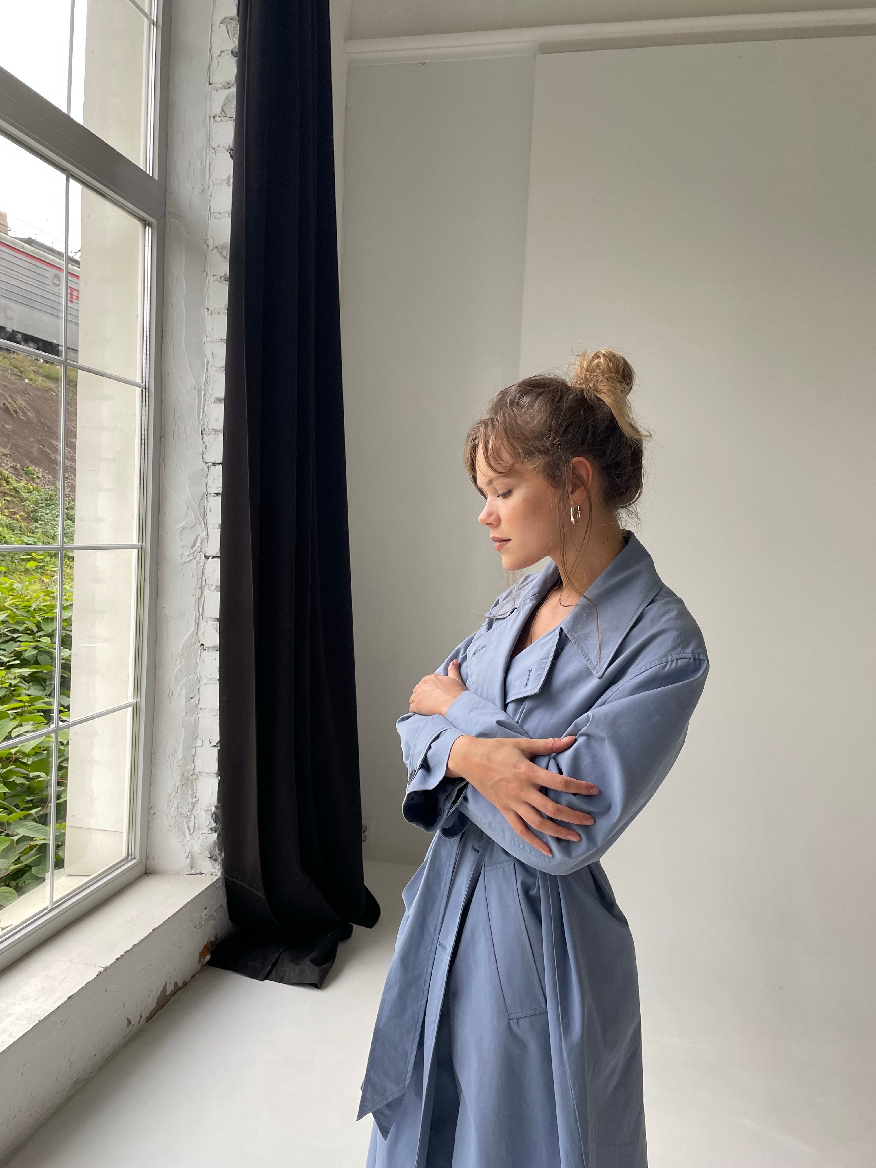 A Woman in Blue Formal Dress Looking at the Scenery through the Glass ...