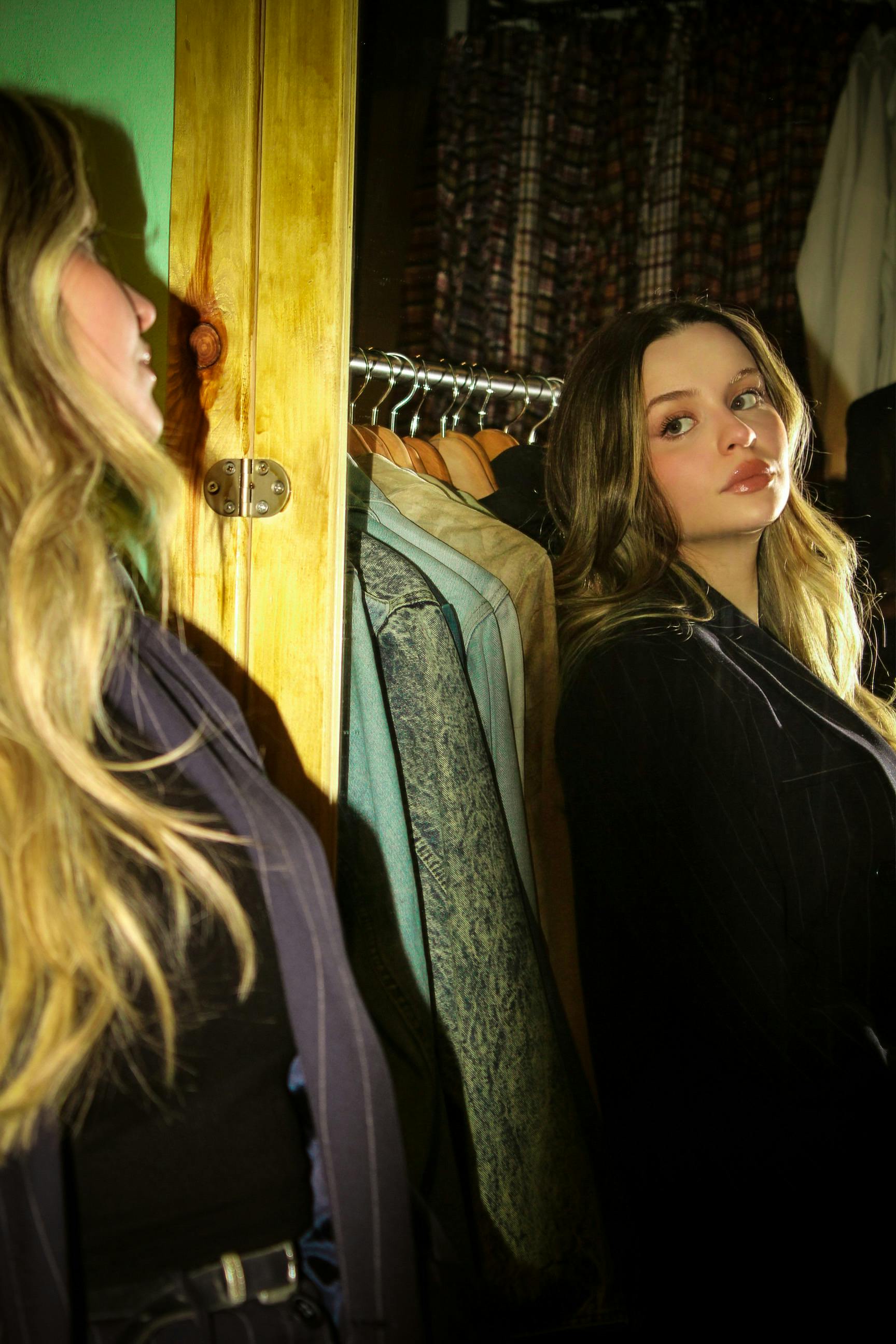 Woman Wearing Futuristic Sunglasses and Heart Choker in Front of the ...