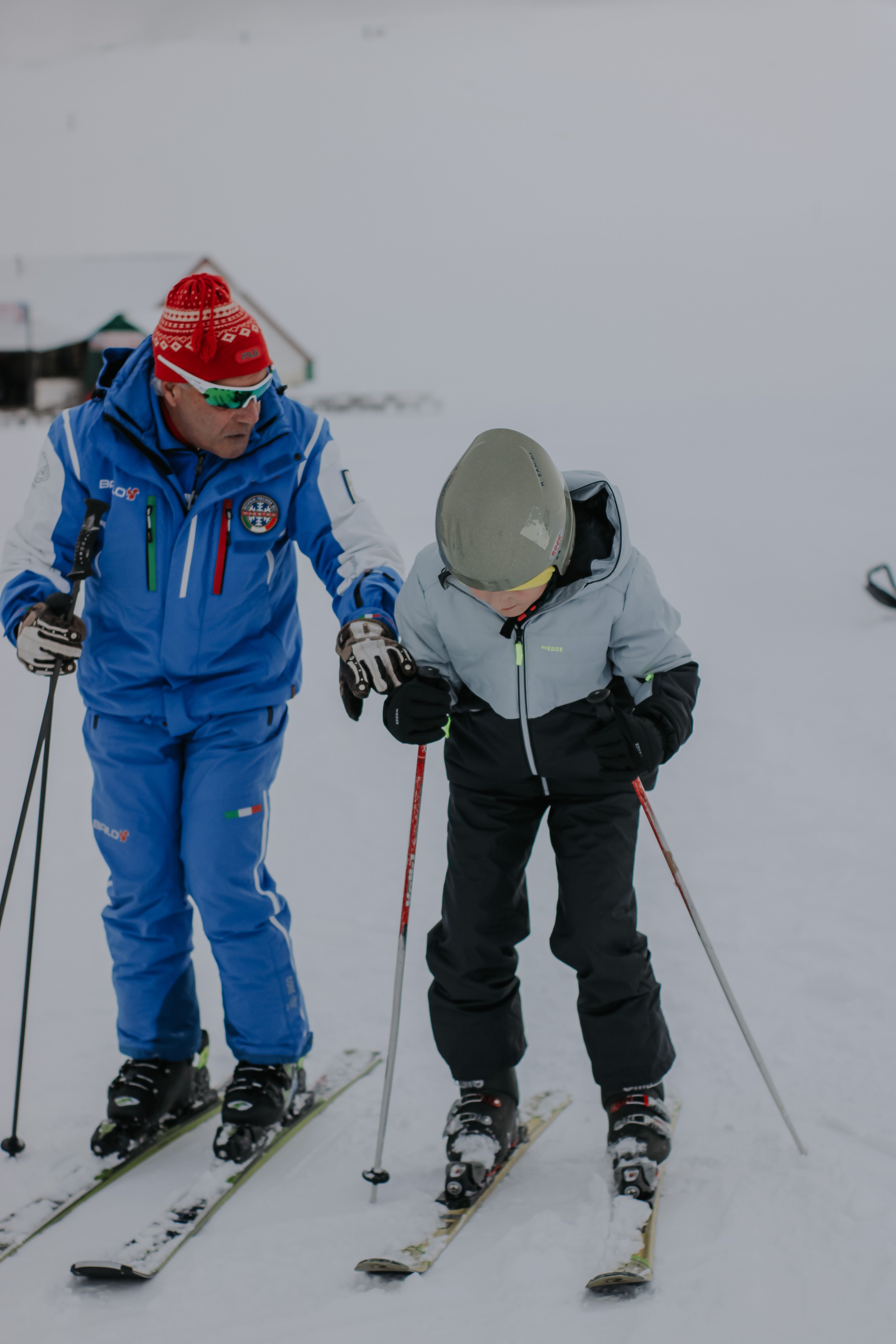 Person Going Up a Mountain with Skis on Shoulder · Free Stock Photo