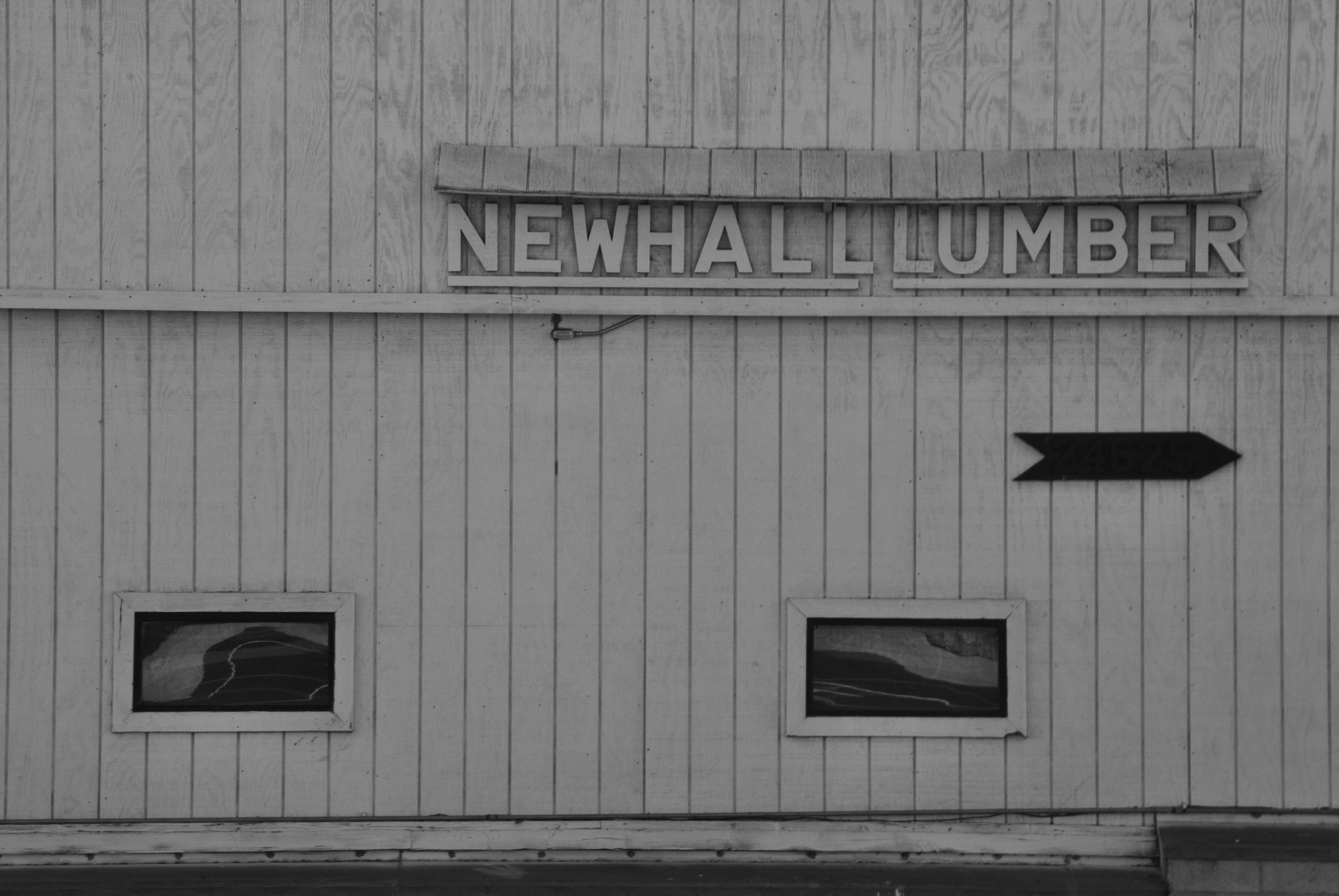 Name on Wooden Building Wall · Free Stock Photo