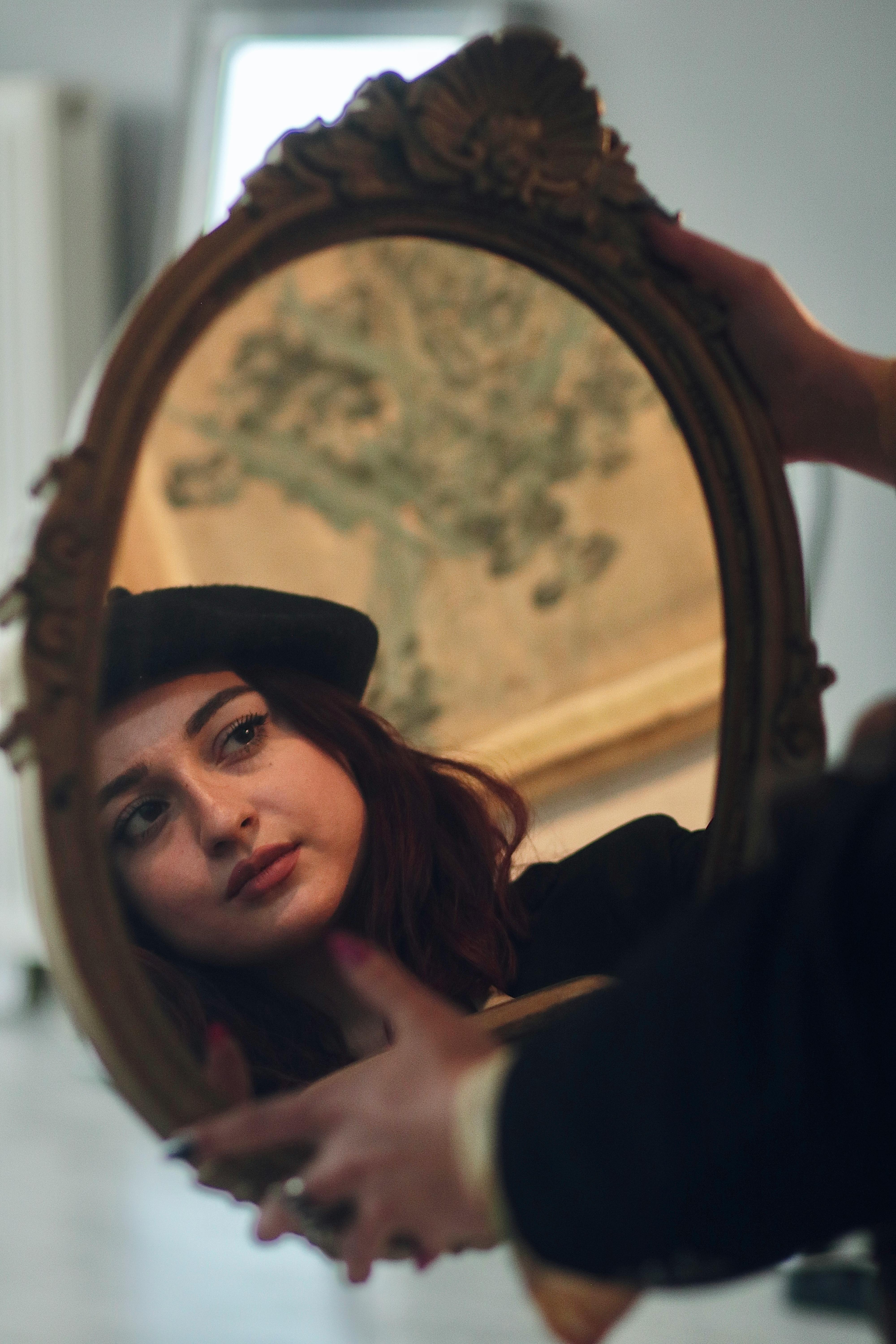 Woman Face Reflection in Decorated Mirror · Free Stock Photo