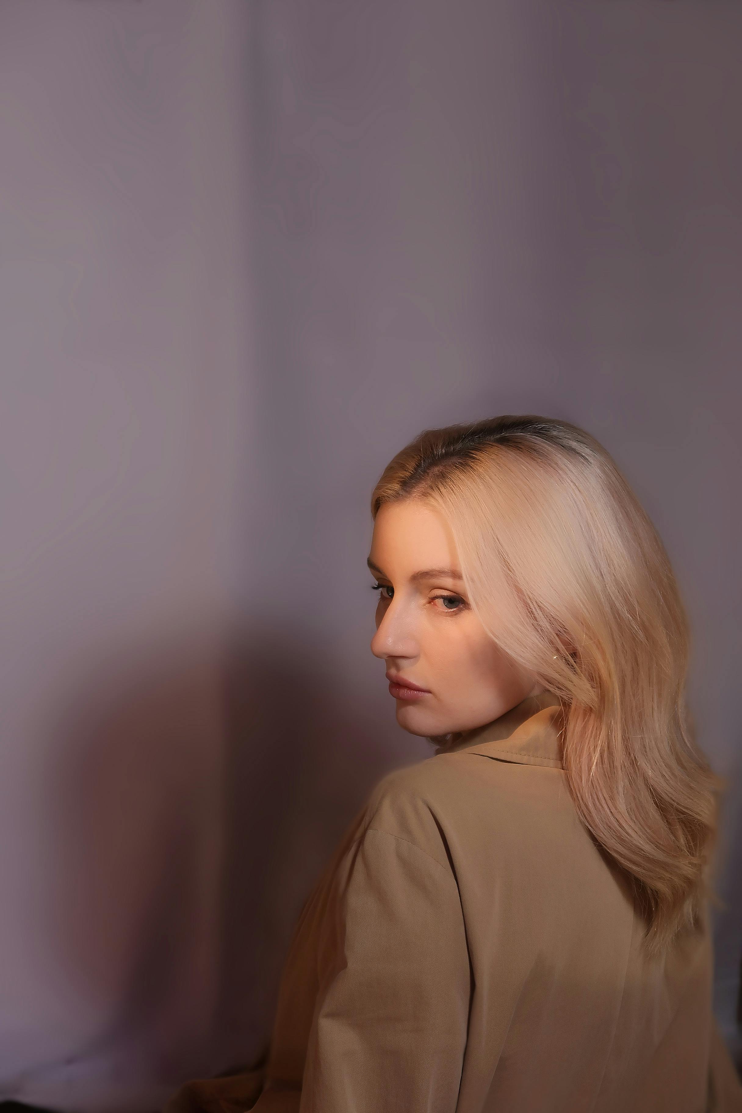 A Woman Looking Over her Shoulder · Free Stock Photo