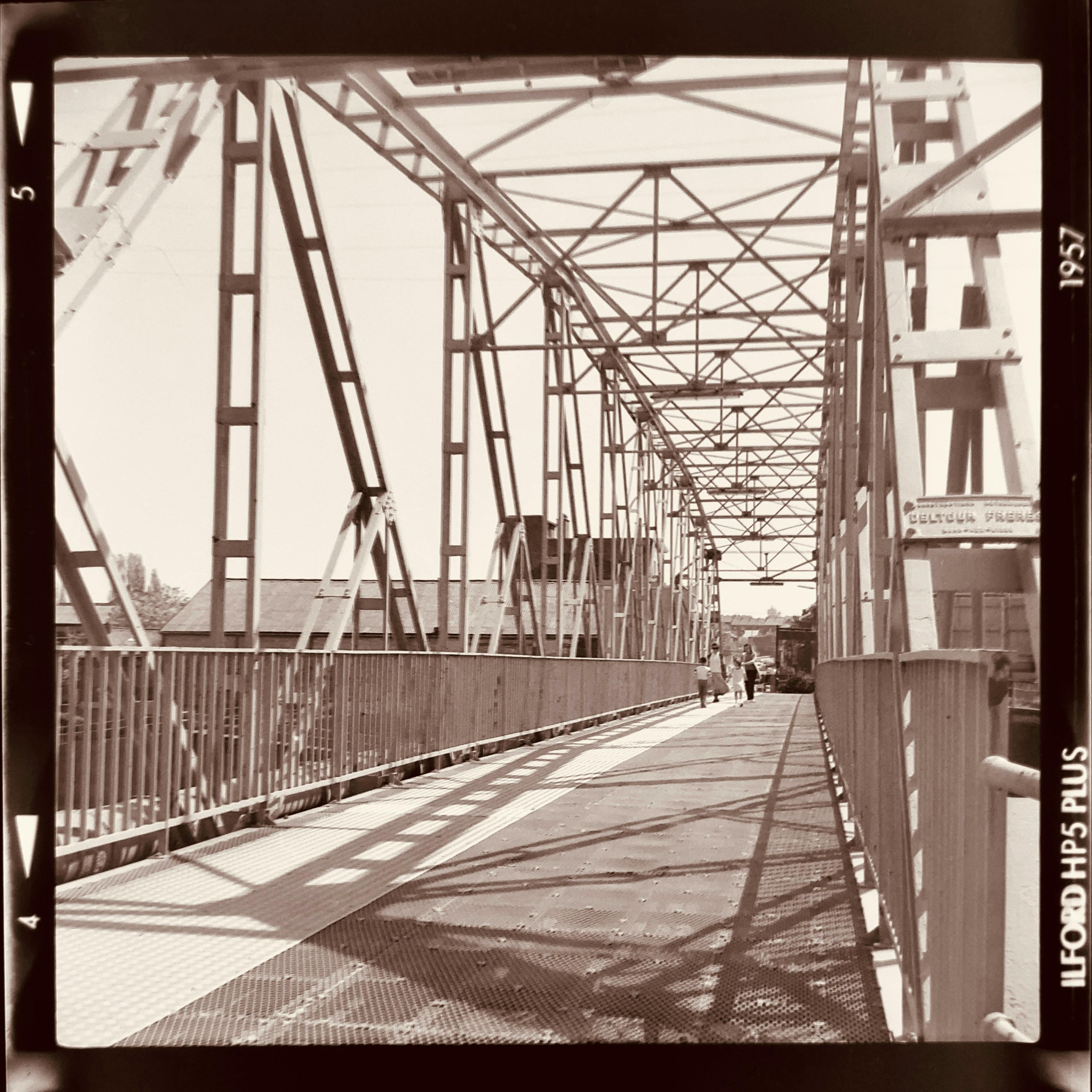 People Walking down a Pedestrian Bridge · Free Stock Photo