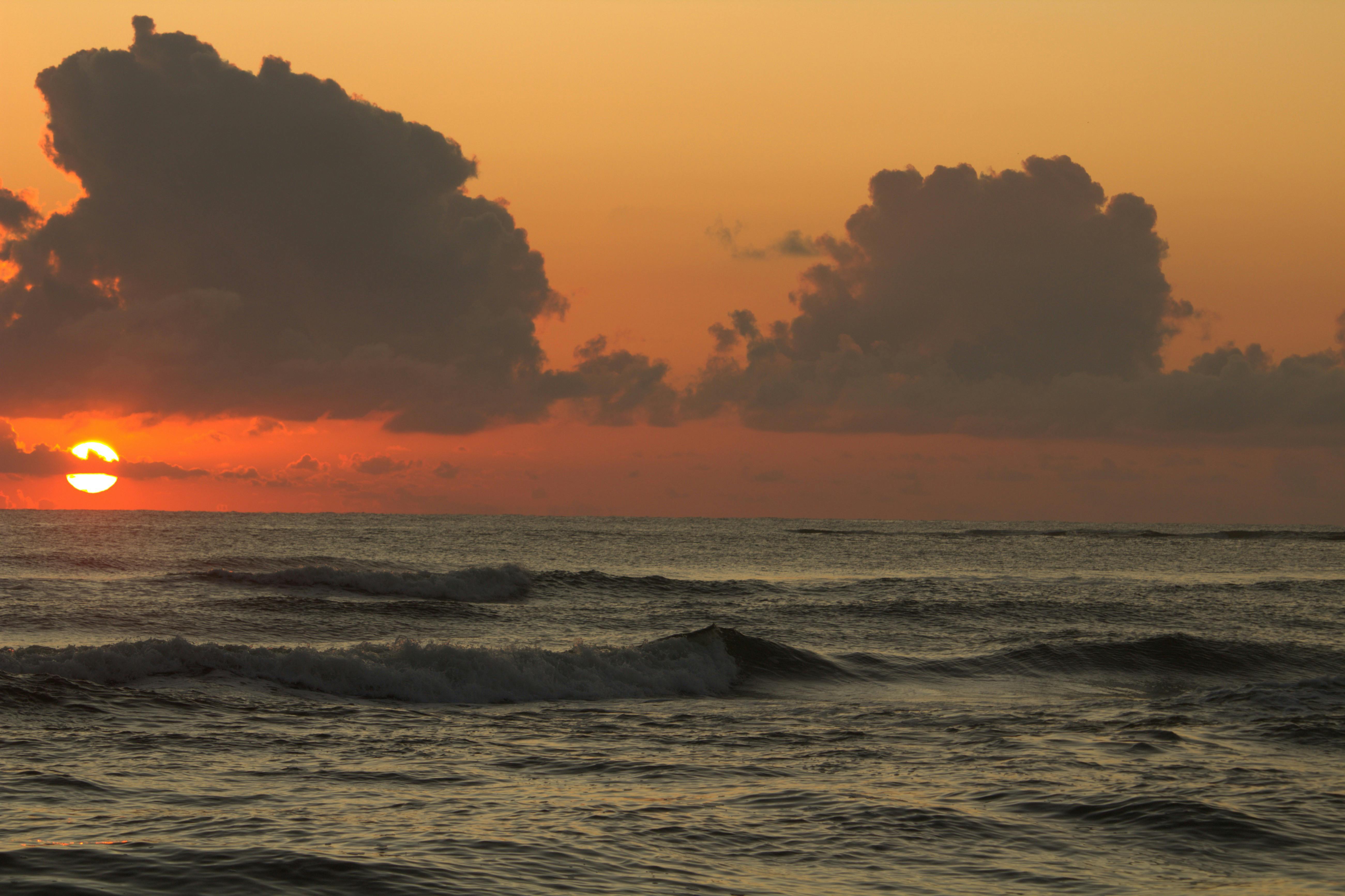 Rain Clouds over Sea Shore at Sunset · Free Stock Photo